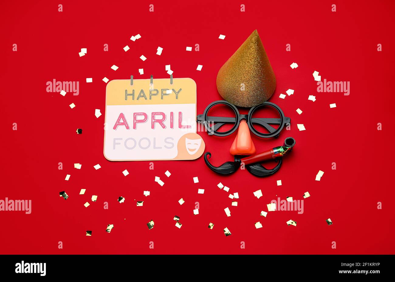 Party decor for April Fools Day on color background Stock Photo - Alamy