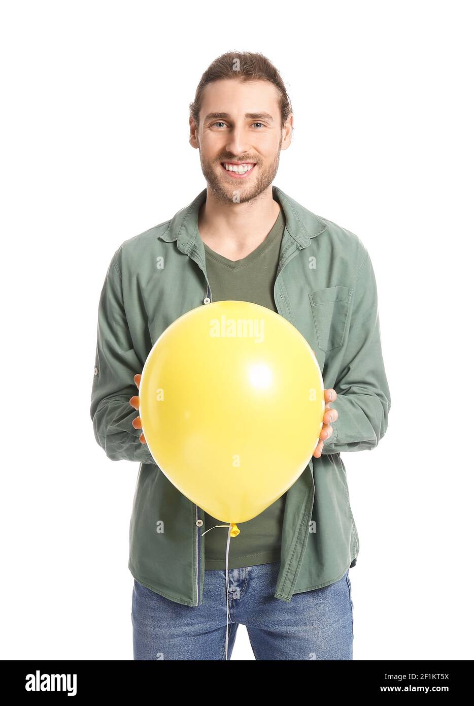Handsome young man with balloon on white background Stock Photo - Alamy