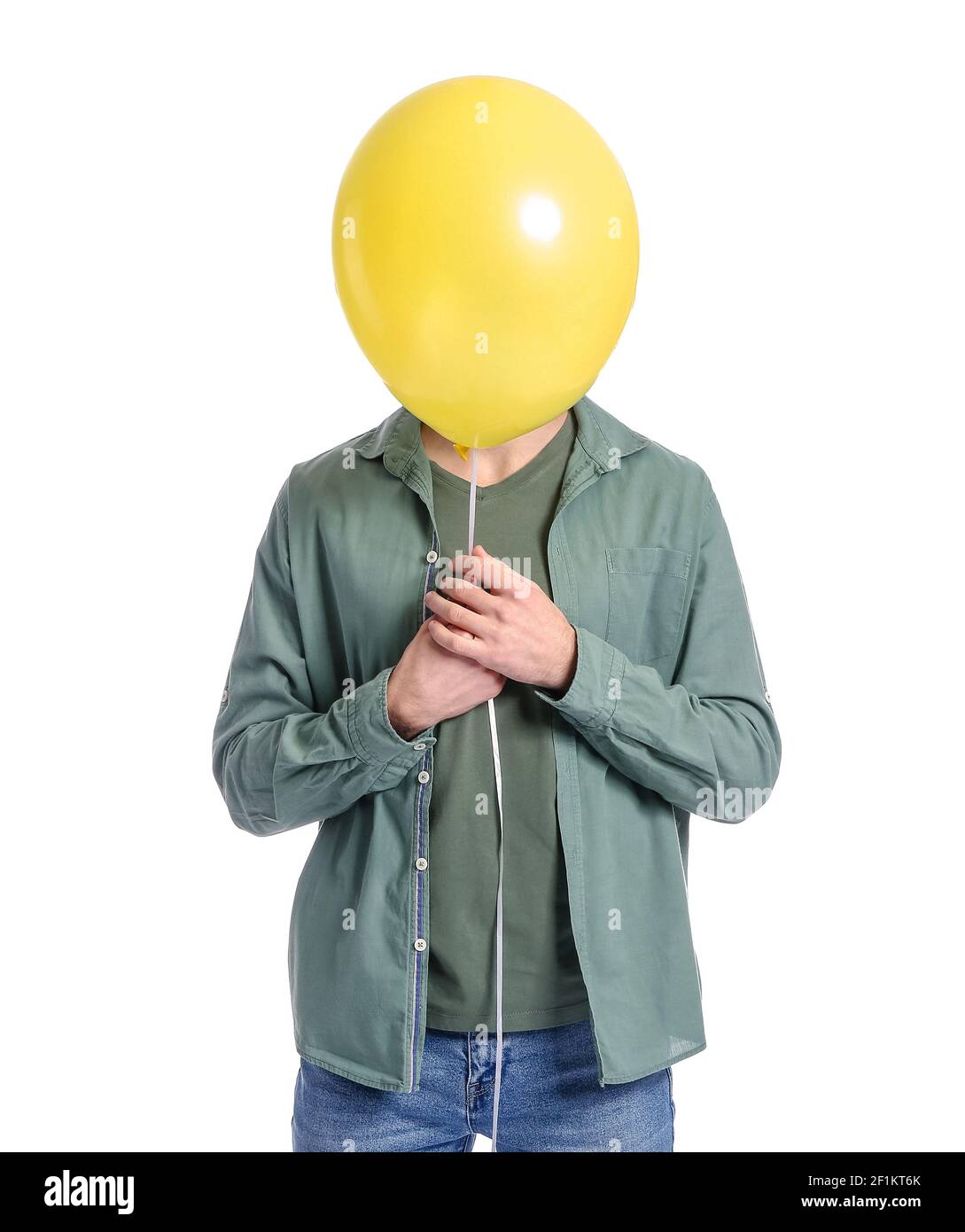 Handsome young man with balloon on white background Stock Photo - Alamy