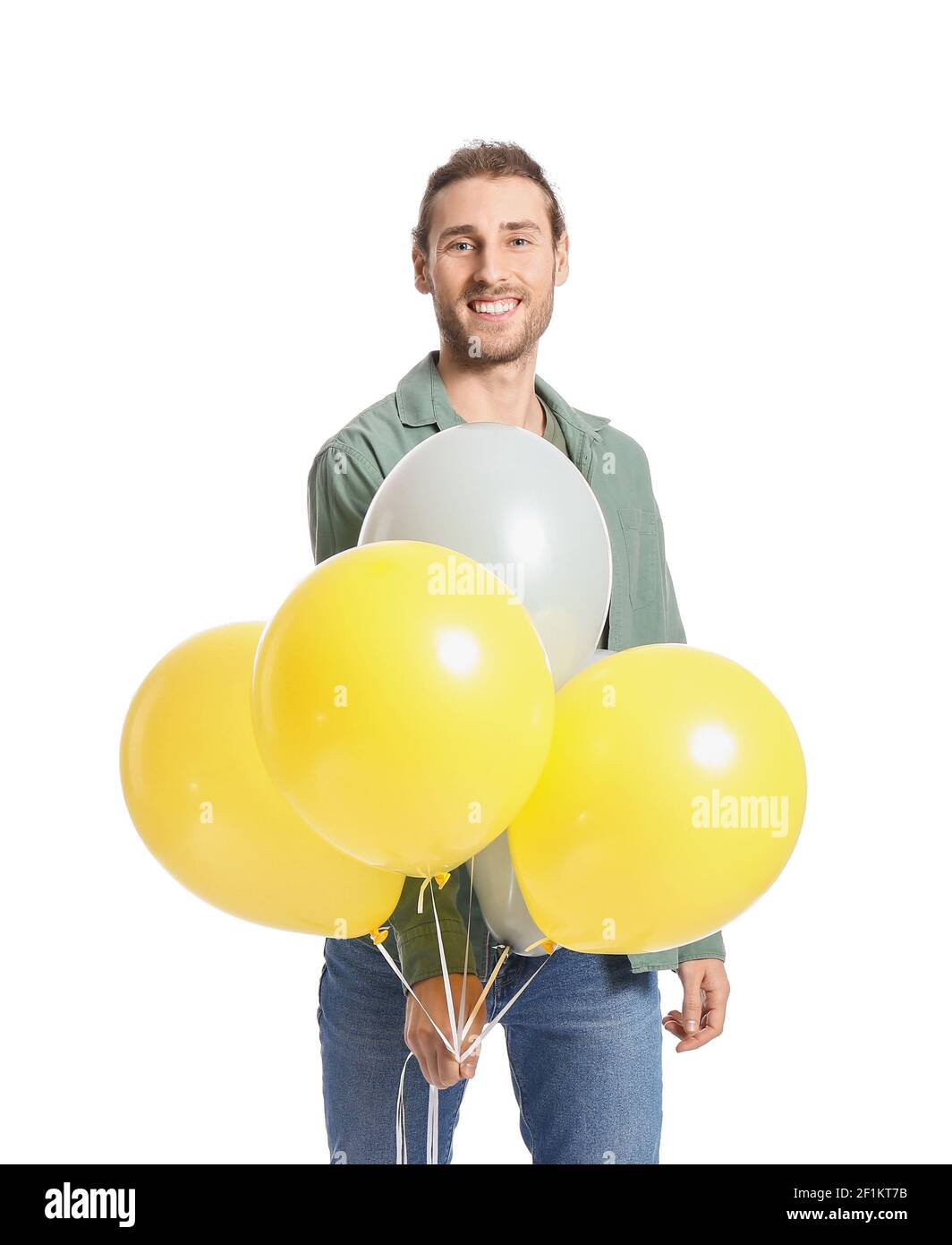 Handsome young man with balloons on white background Stock Photo - Alamy