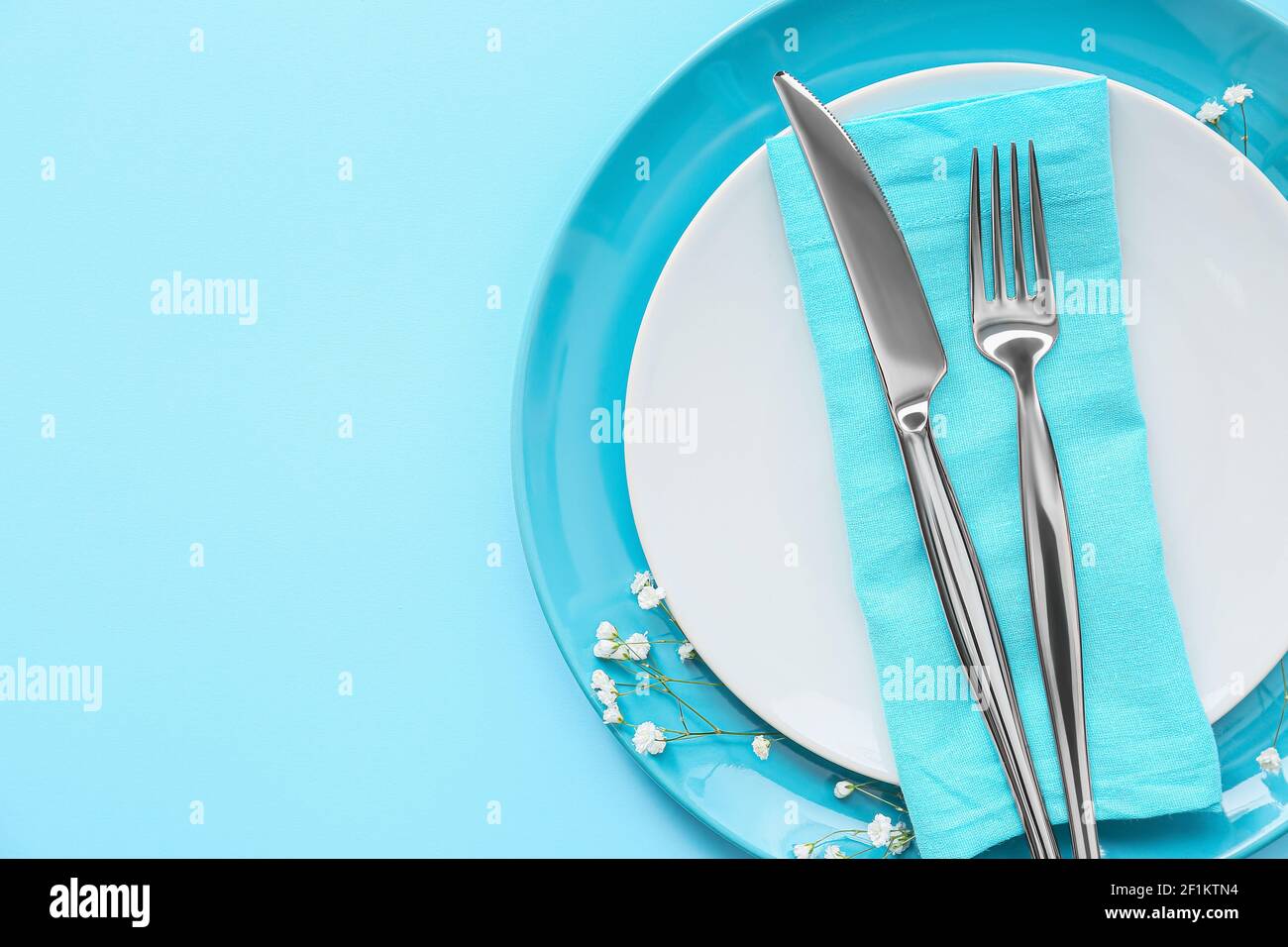 Beautiful table setting on color background Stock Photo - Alamy
