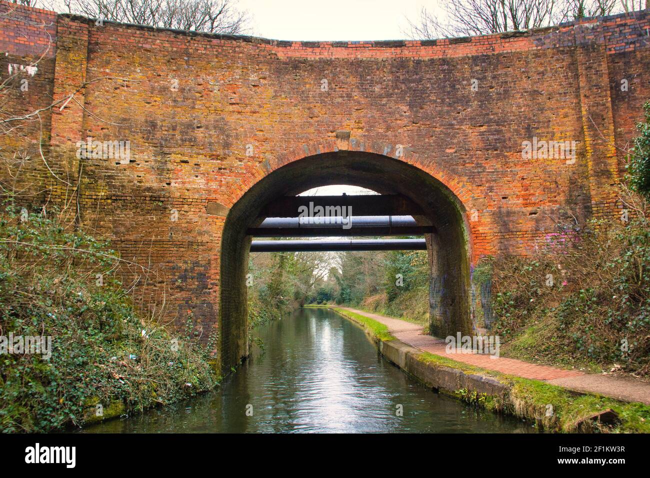 Arched bridge over canal Stock Photo - Alamy