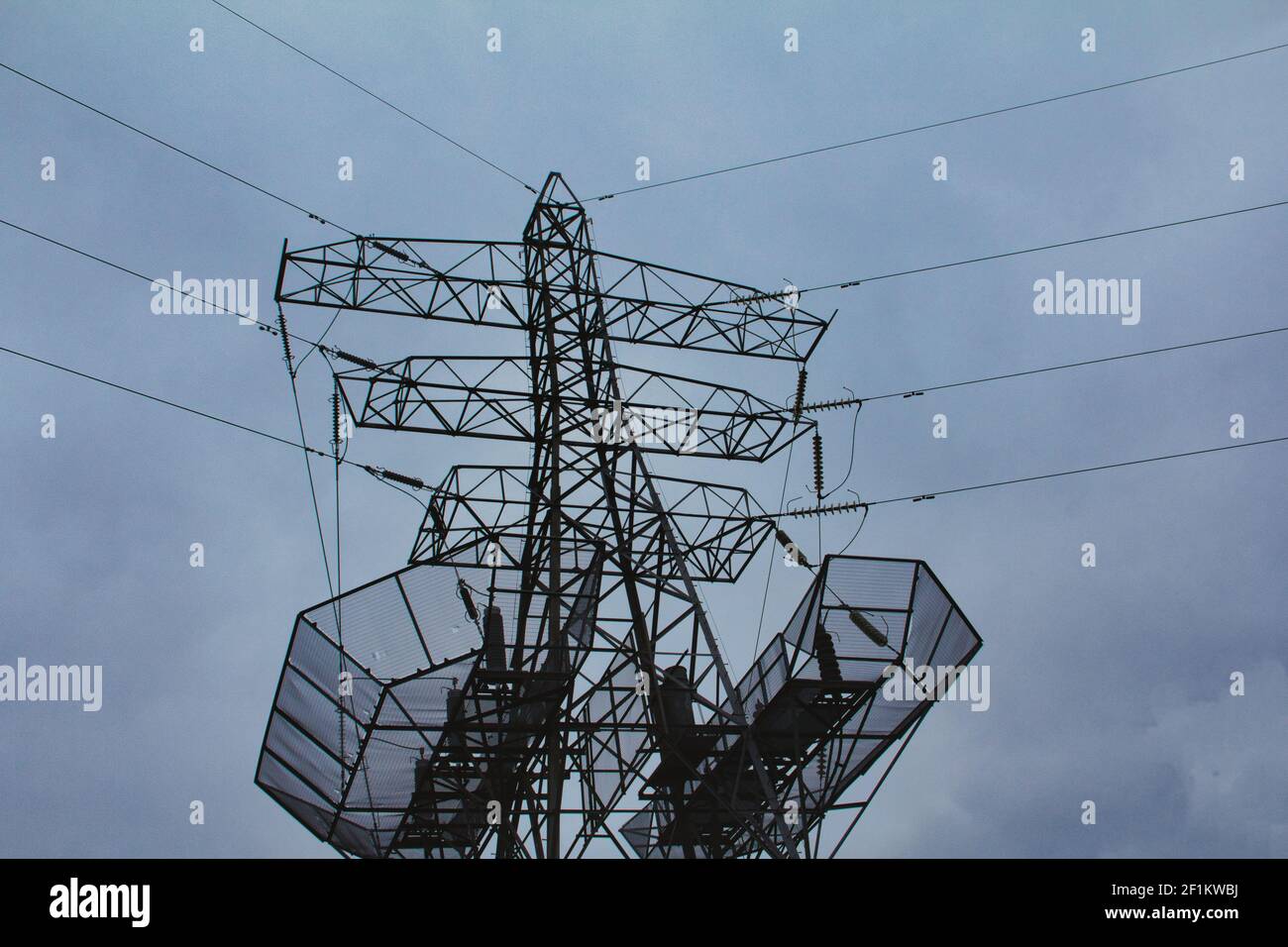 Pylon against dark sky Stock Photo - Alamy