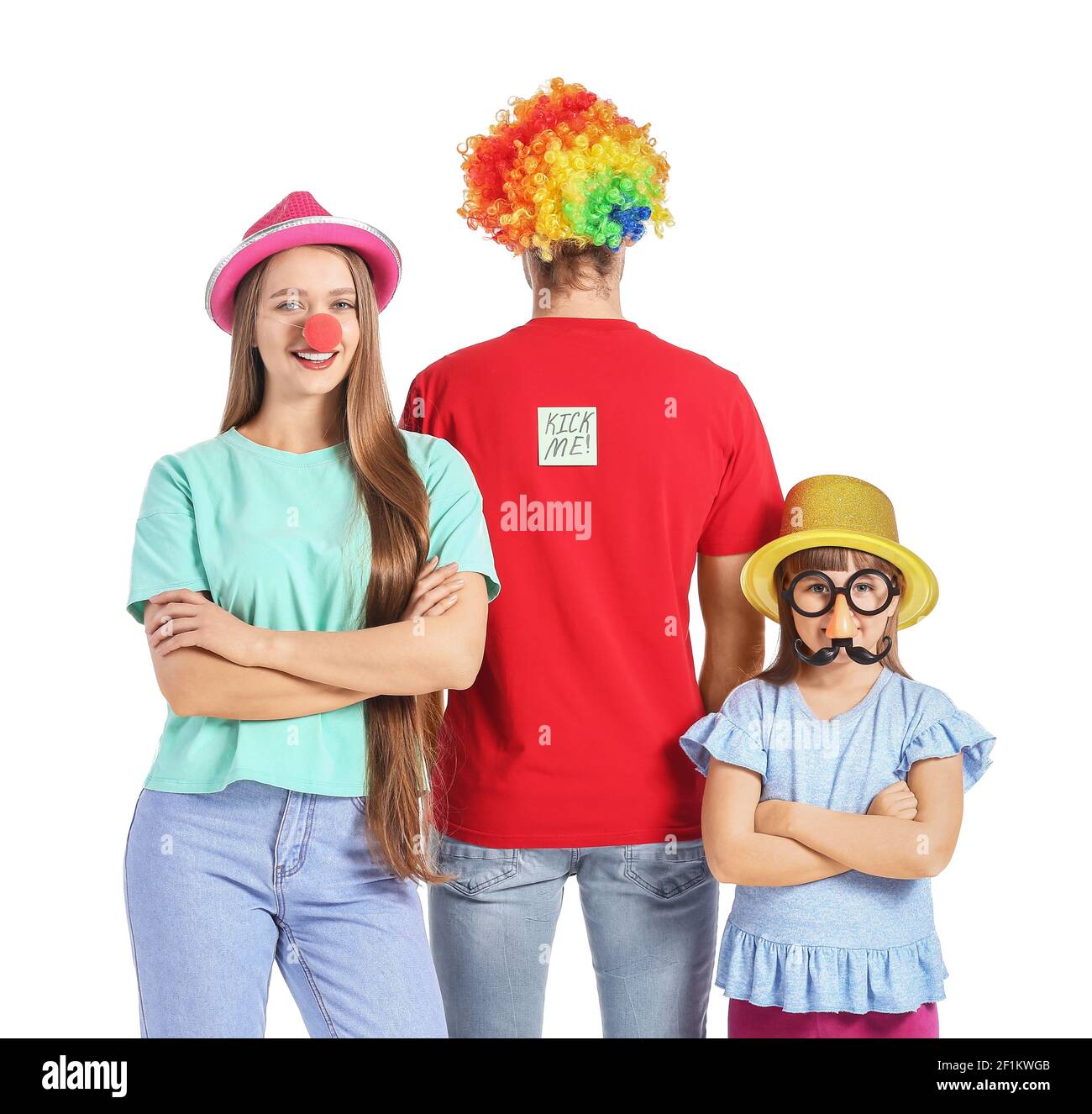 Little girl and her mother playing a prank on young man against white ...