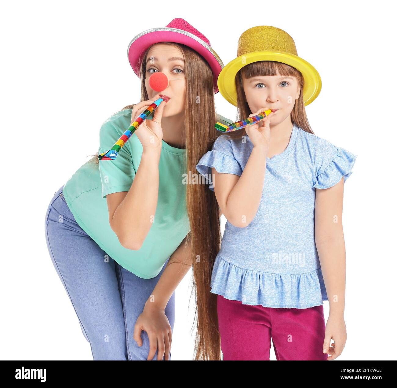 Little girl and her mother in funny disguise on white background. April ...
