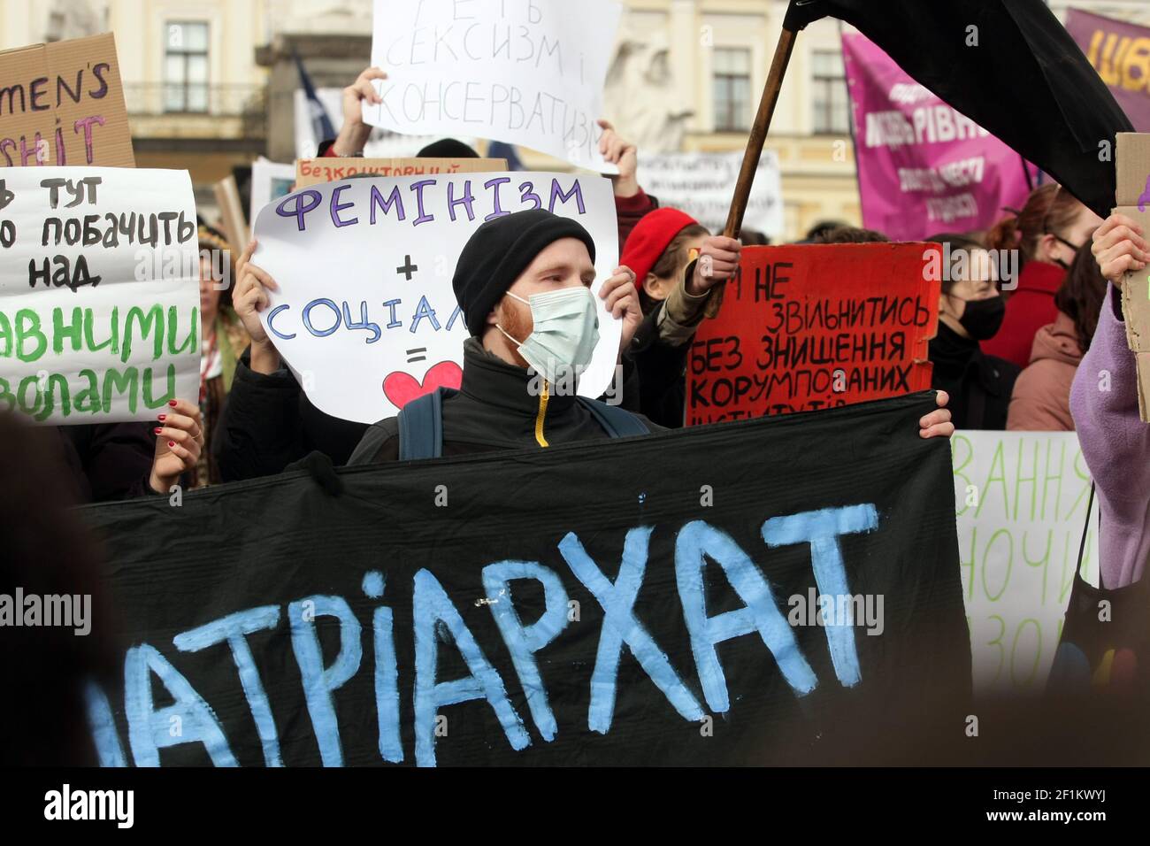 Non Exclusive: KYIV, UKRAINE - MARCH 8, 2021 - A man holds a banner ...