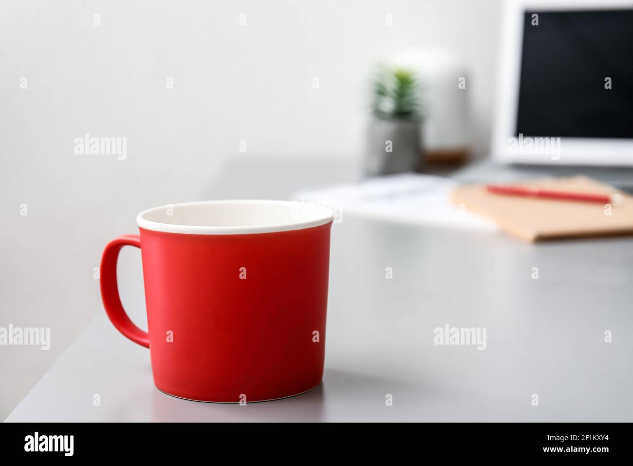 Cup of tea on office table Stock Photo - Alamy