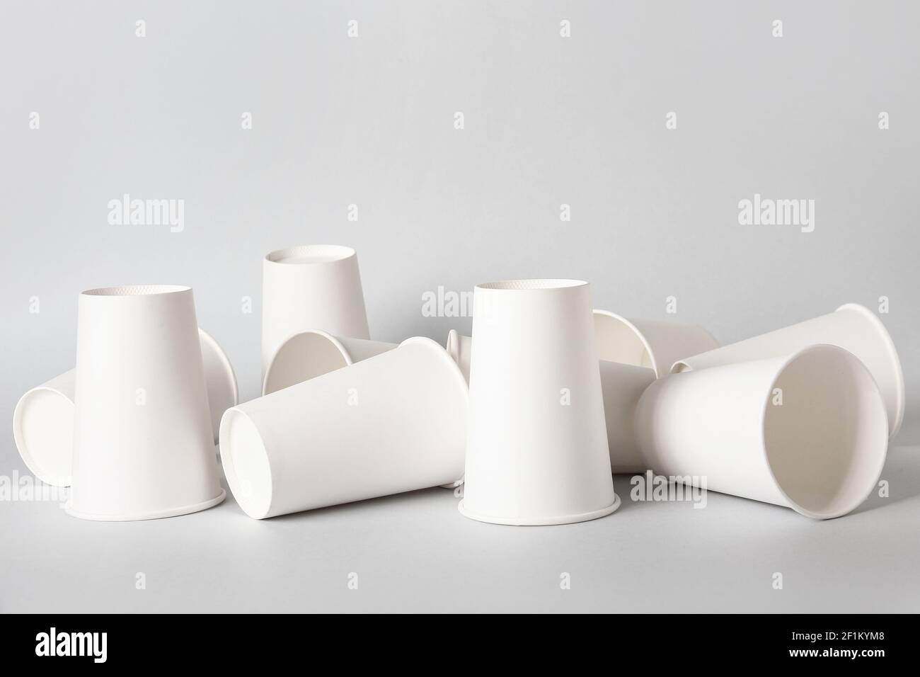 Blank takeaway cups on light background Stock Photo - Alamy