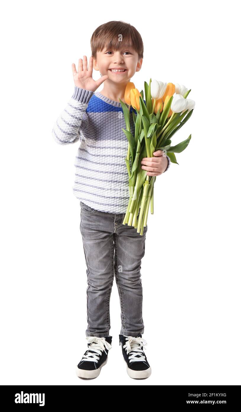 Cute little boy with spring flowers on white background Stock Photo - Alamy