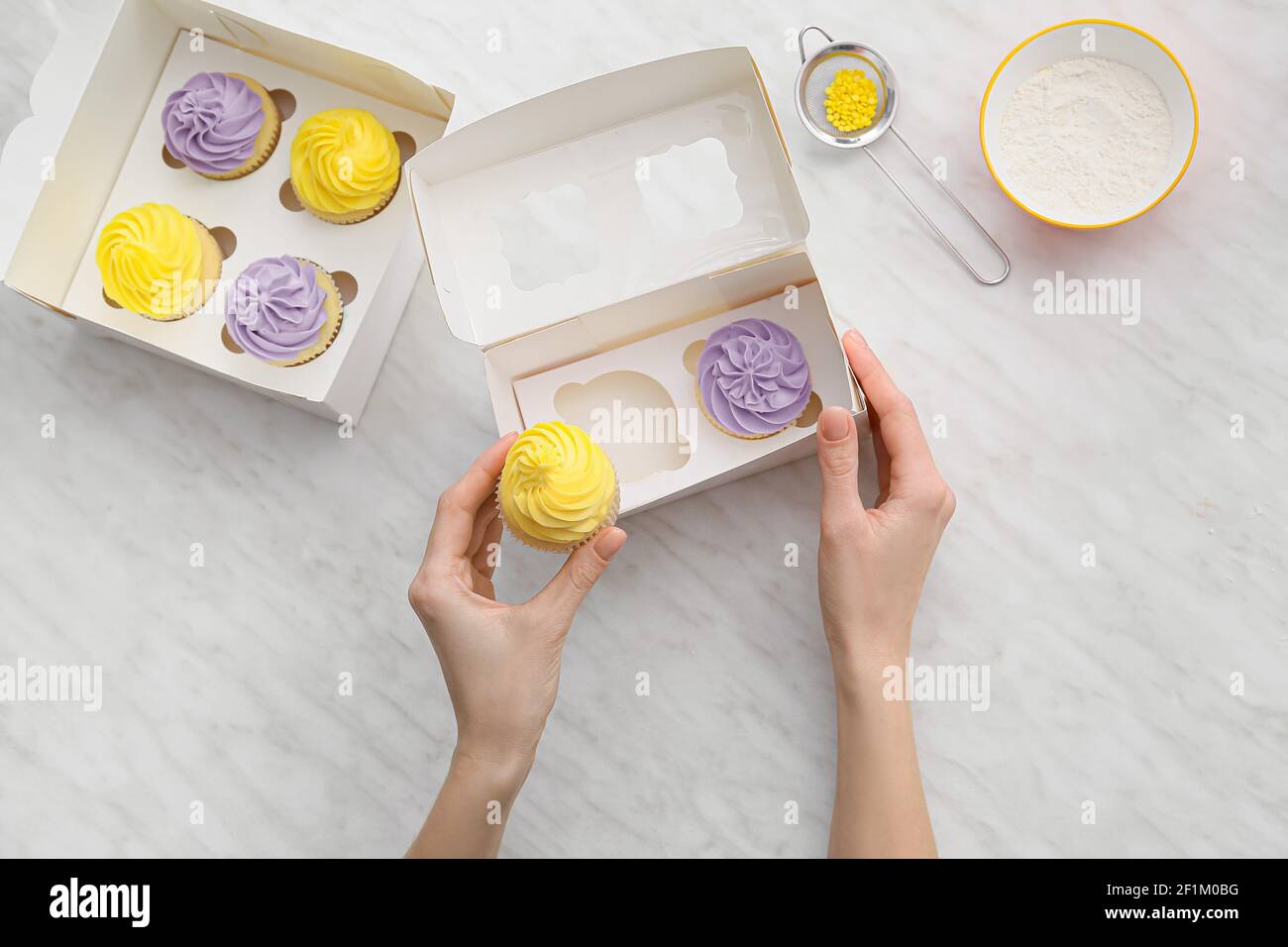 Woman box tasty cupcakes hi-res stock photography and images - Alamy