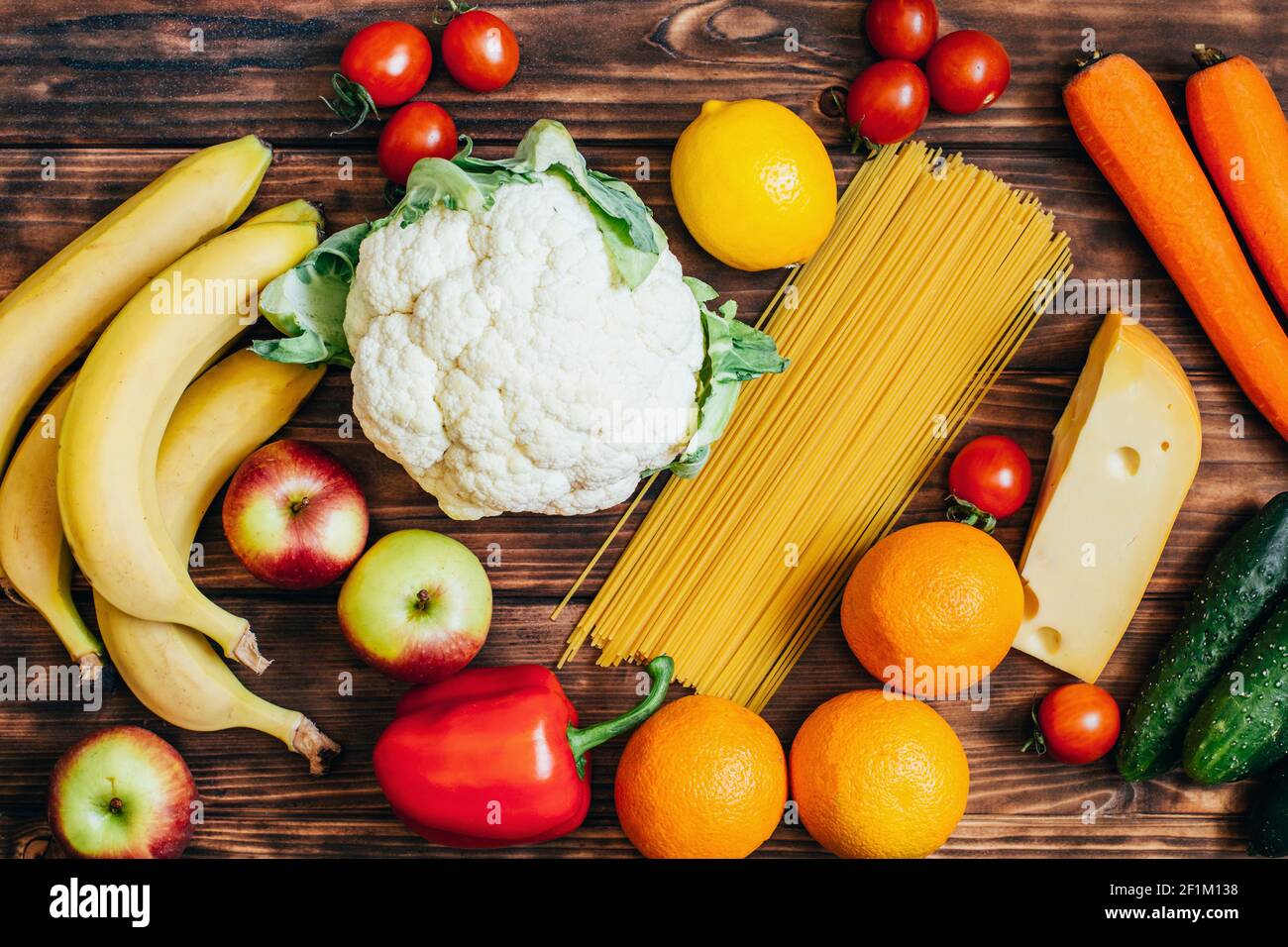 top view set of food vegetables fruits dairy products on wooden ...