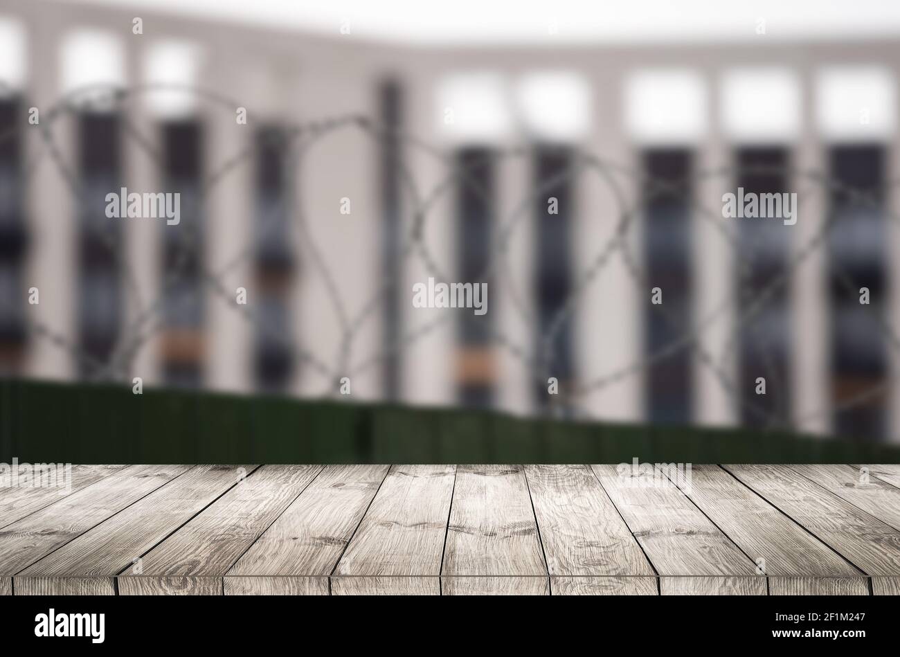 Empty wooden table on barbed wire for background Stock Photo - Alamy