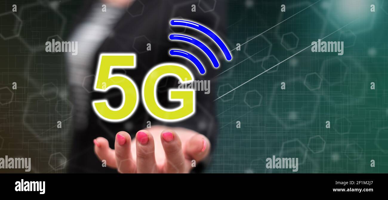 5g concept above the hand of a woman in background Stock Photo - Alamy