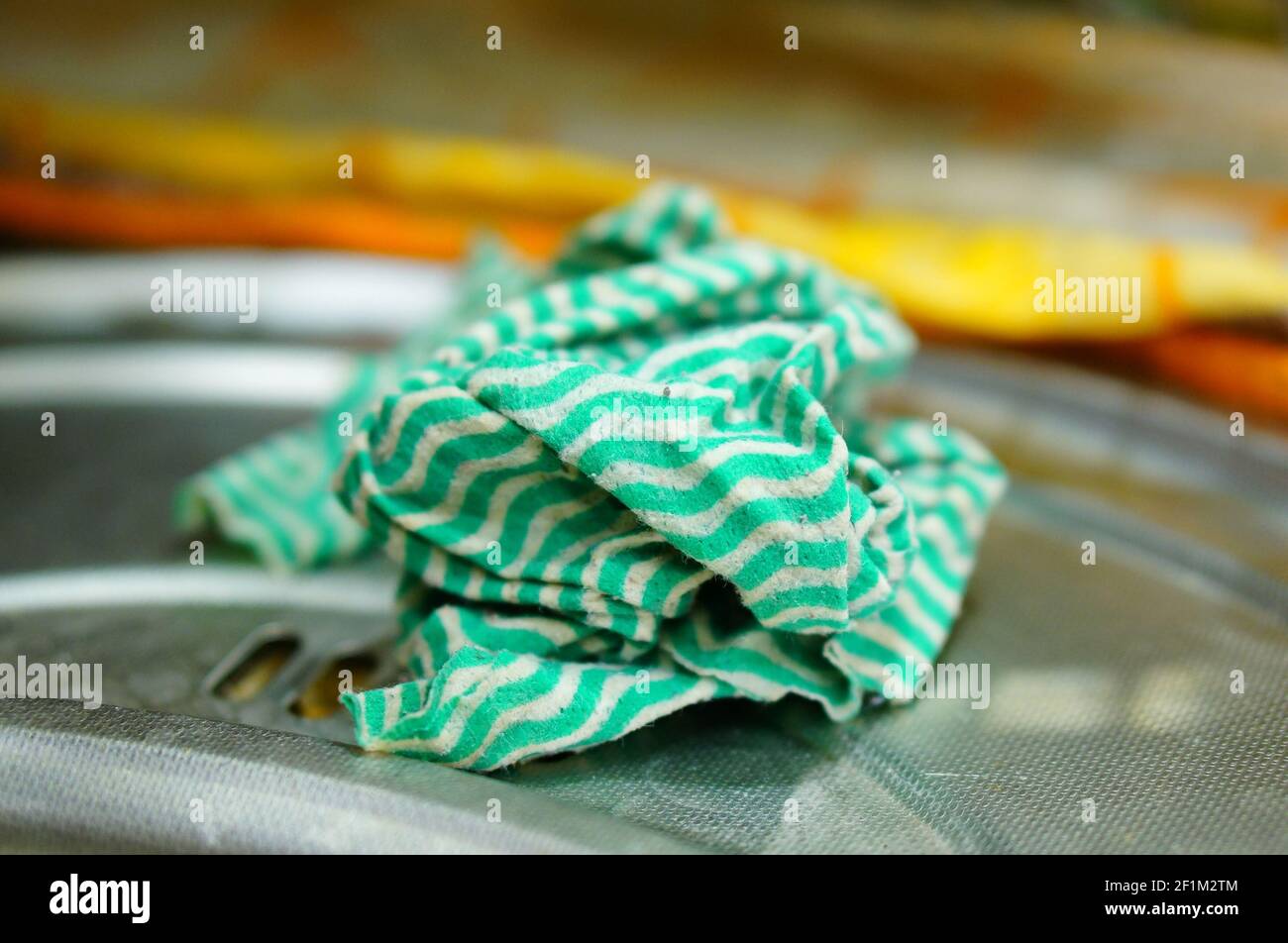 Green cleaning cloth by a sink Stock Photo - Alamy