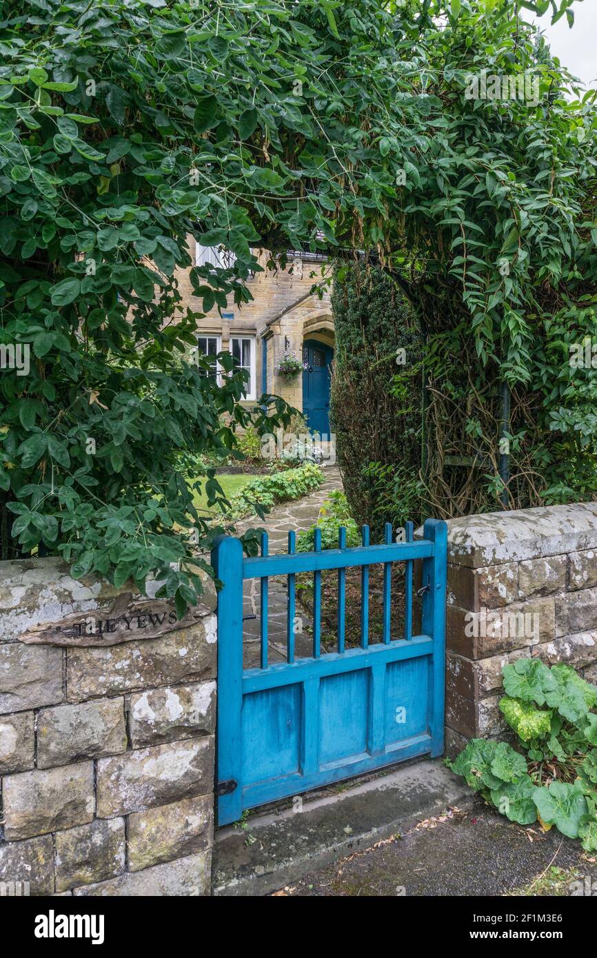 Wooden gate leading to a front garden in the estate village of Edensor ...
