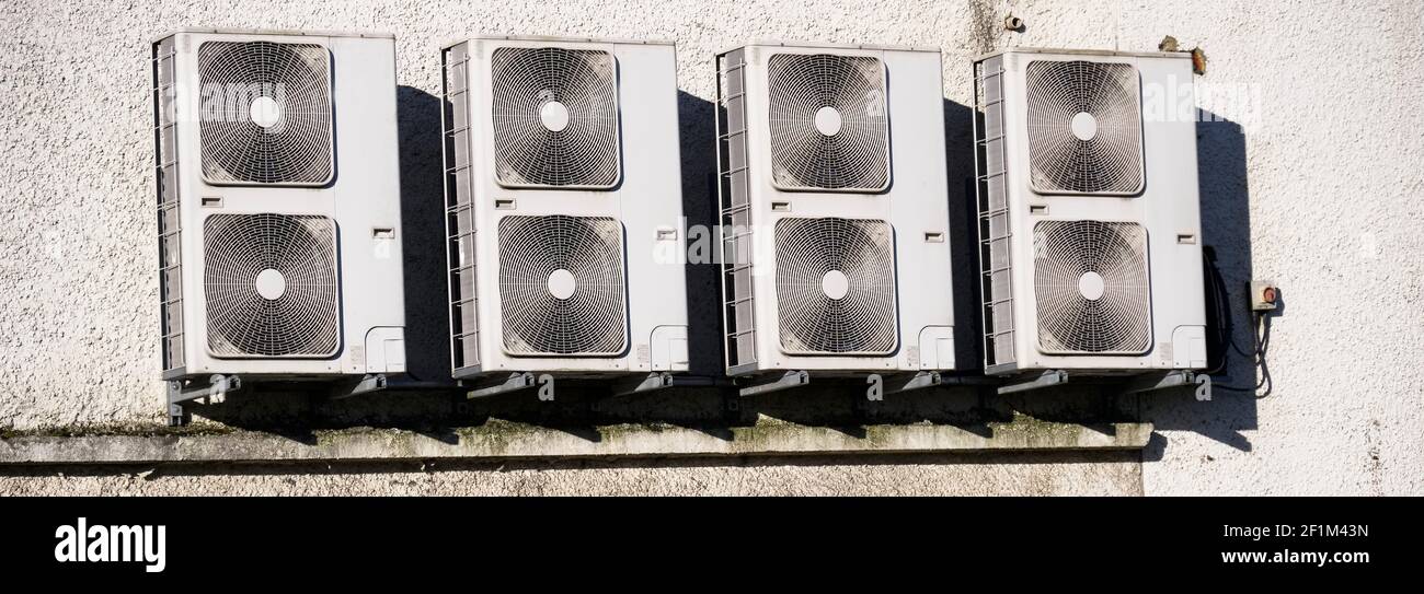 Condenser units for air conditioning system wall mounted outdoors Stock ...