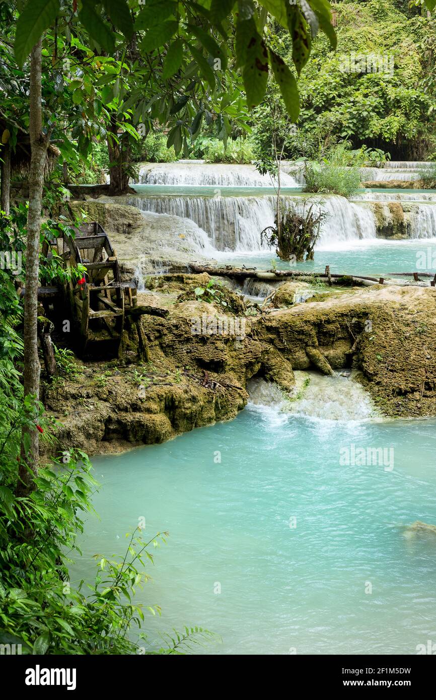 Blue water from waterfall flow down step by step Stock Photo - Alamy