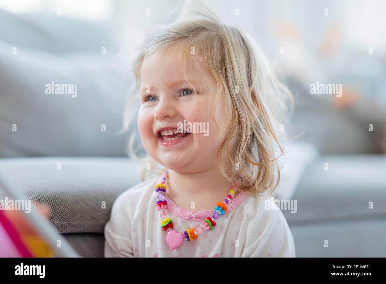 Happy girl looking jewelry hi-res stock photography and images - Alamy