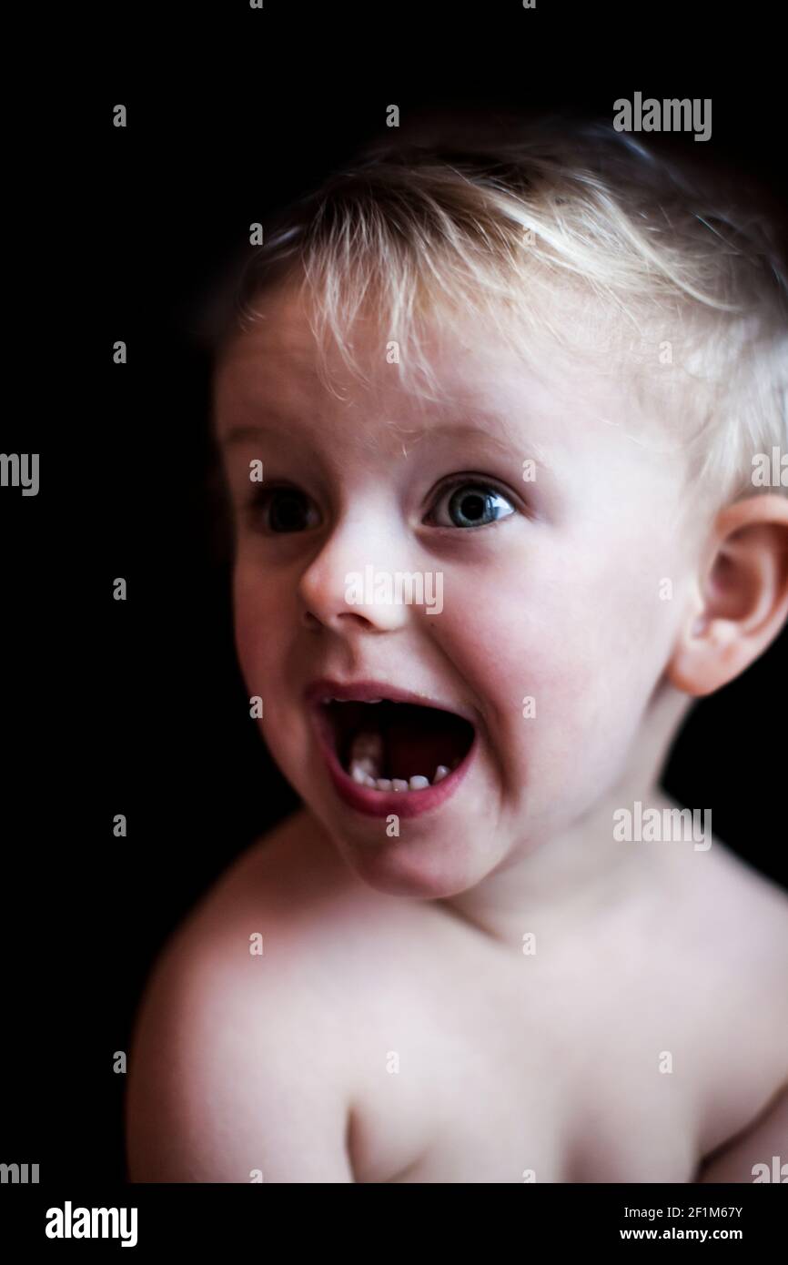 Portrait of surprised baby Stock Photo - Alamy