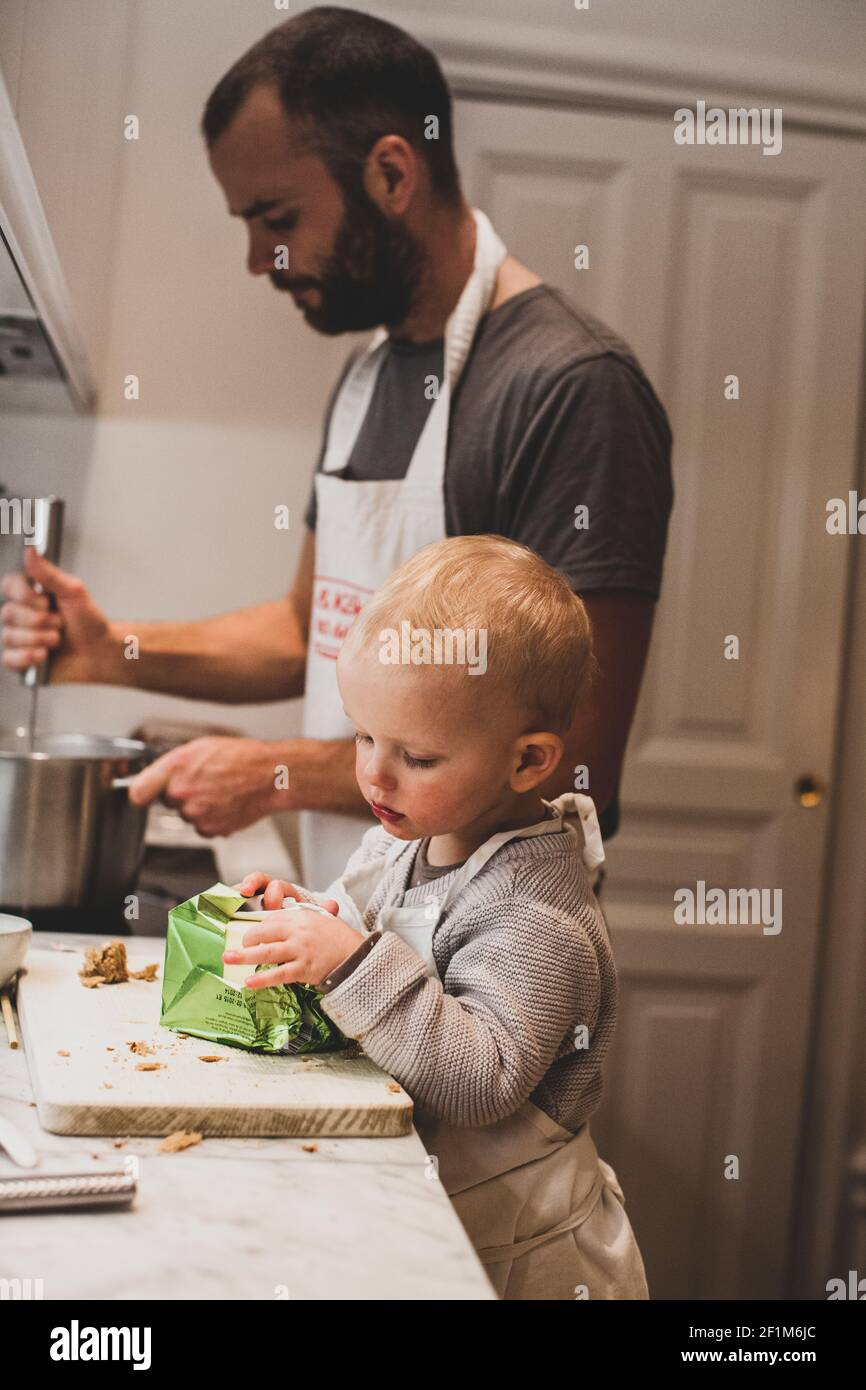 Father and son cooking together Stock Photo - Alamy