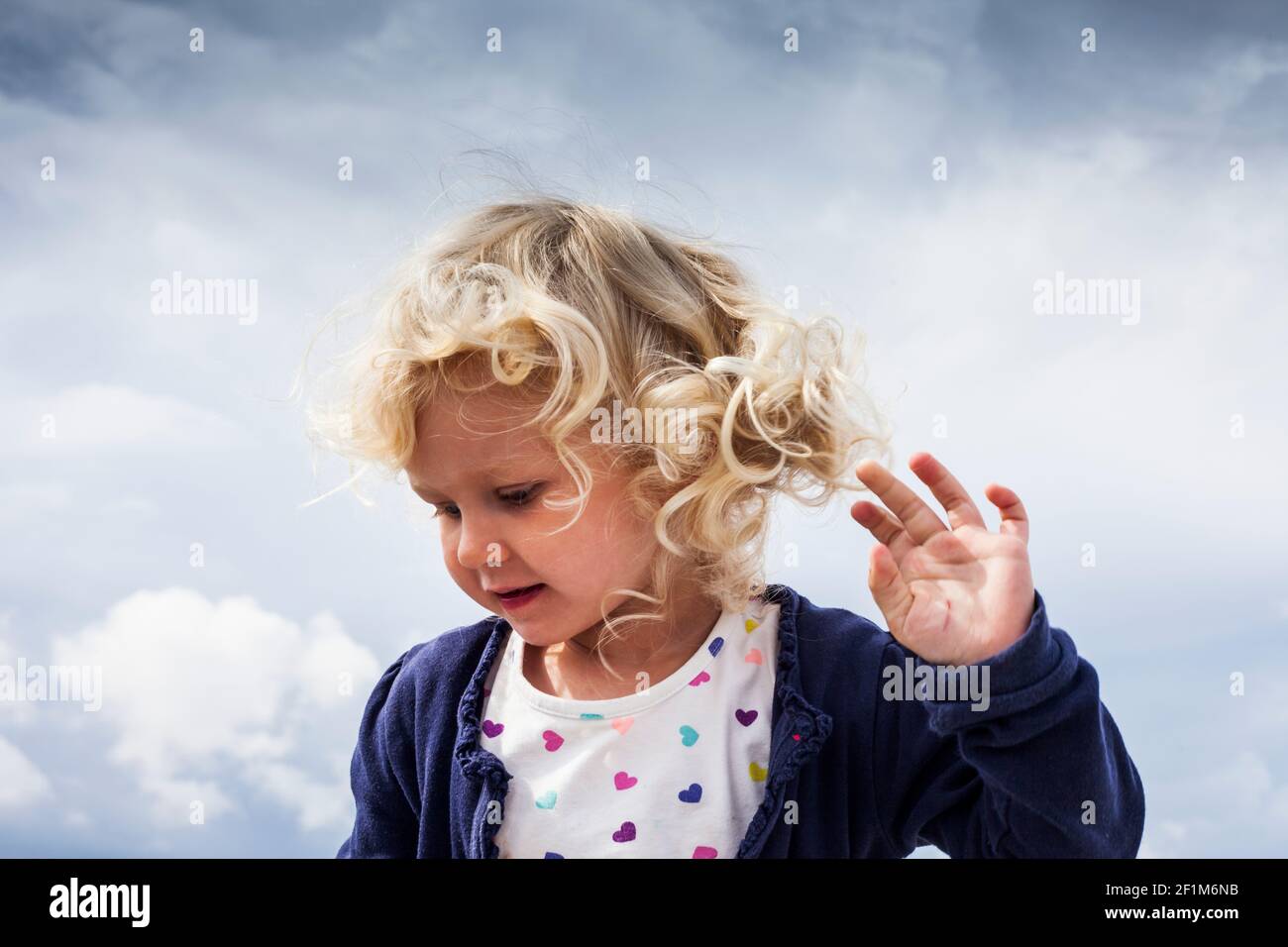 Girl cloudy sky sky hi-res stock photography and images - Alamy