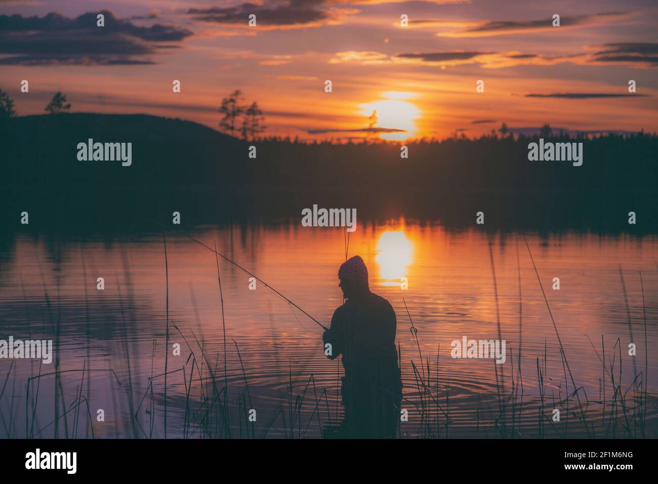 Man fishing back view hi-res stock photography and images - Alamy