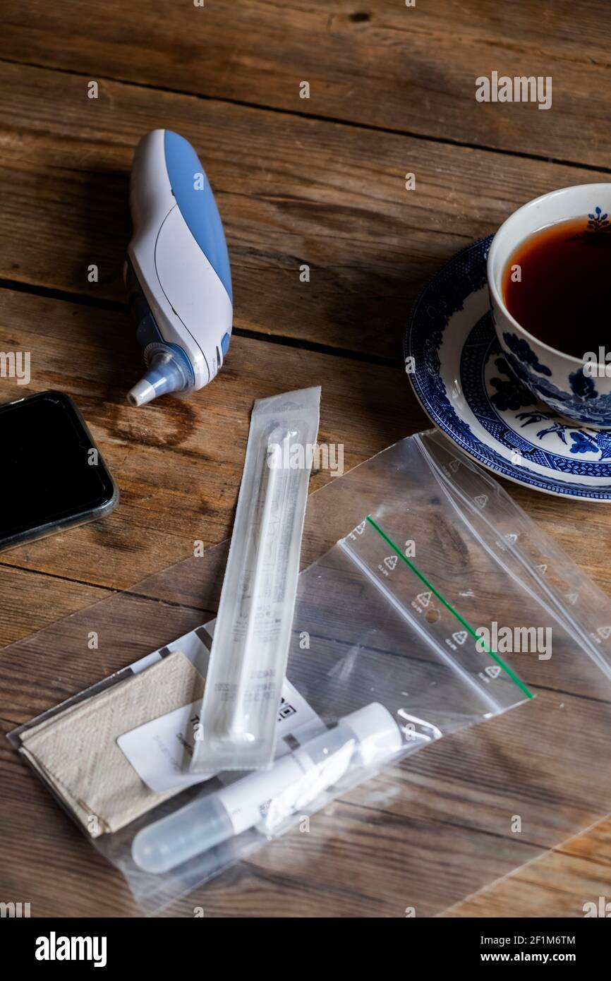 Covid-19 test and cup of tea Stock Photo - Alamy