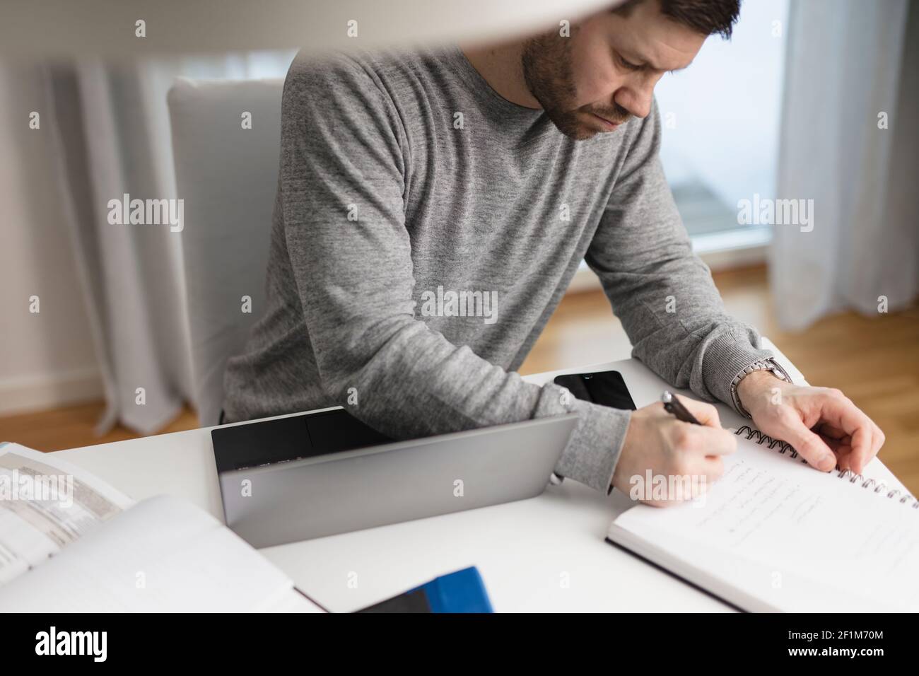 Man working at home Stock Photo - Alamy
