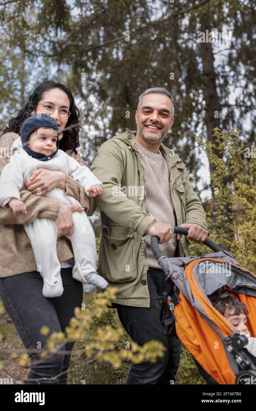 Parents with two children having walk Stock Photo - Alamy