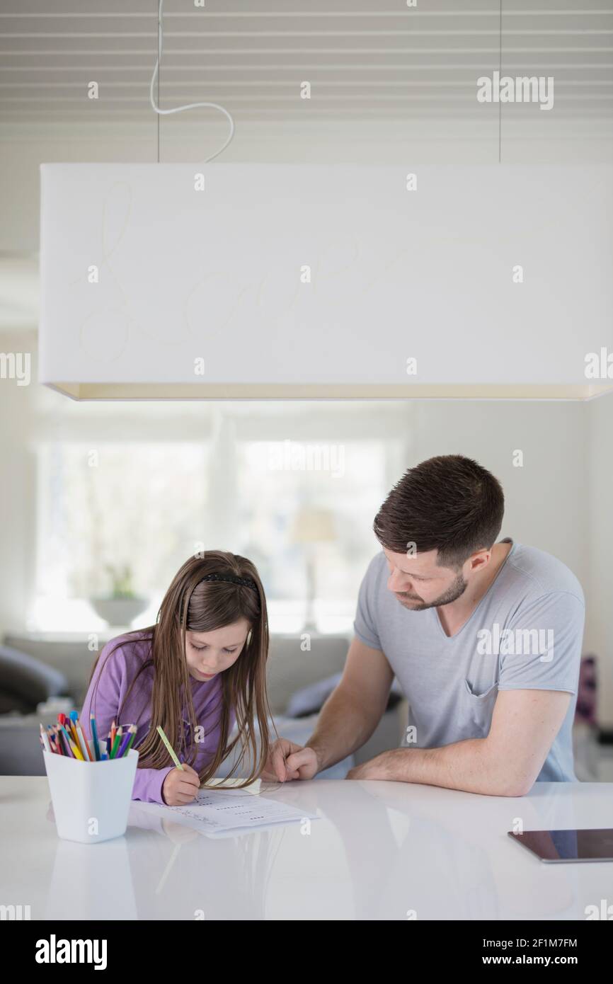 Children homework family help hi-res stock photography and images - Alamy