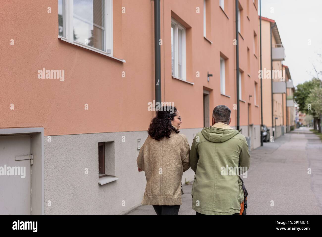 Rear view of couple walking together Stock Photo - Alamy