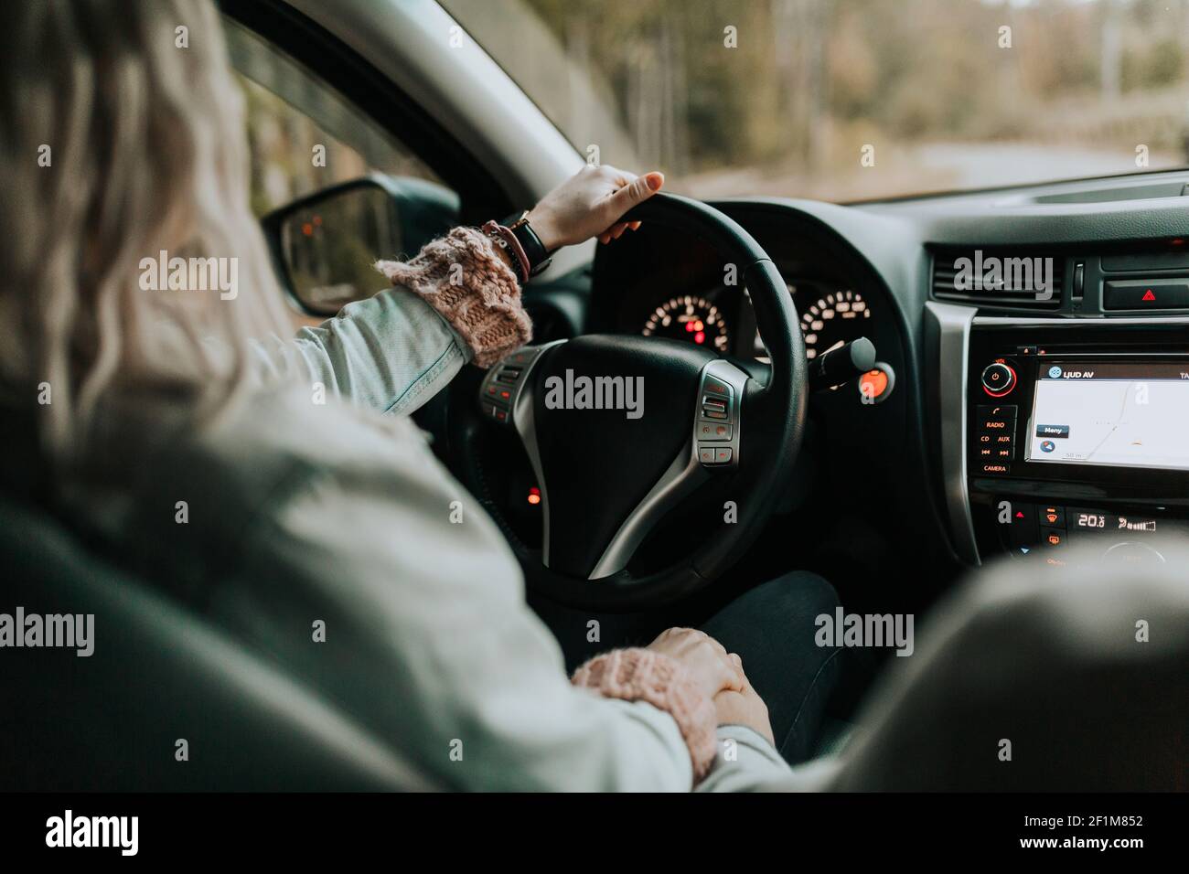 Rear view of female driver Stock Photo - Alamy