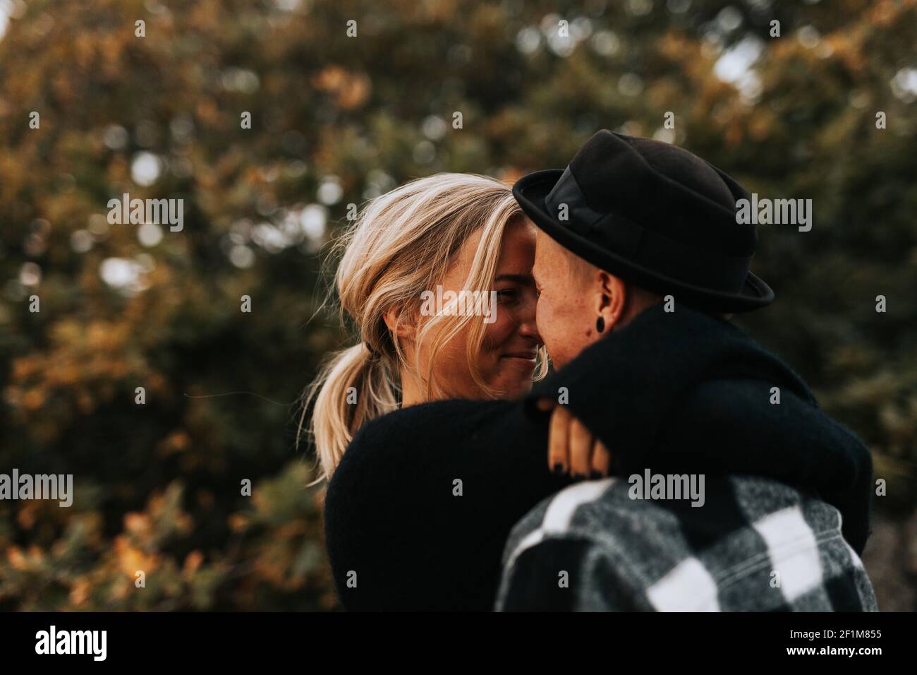 Female couple hugging Stock Photo - Alamy