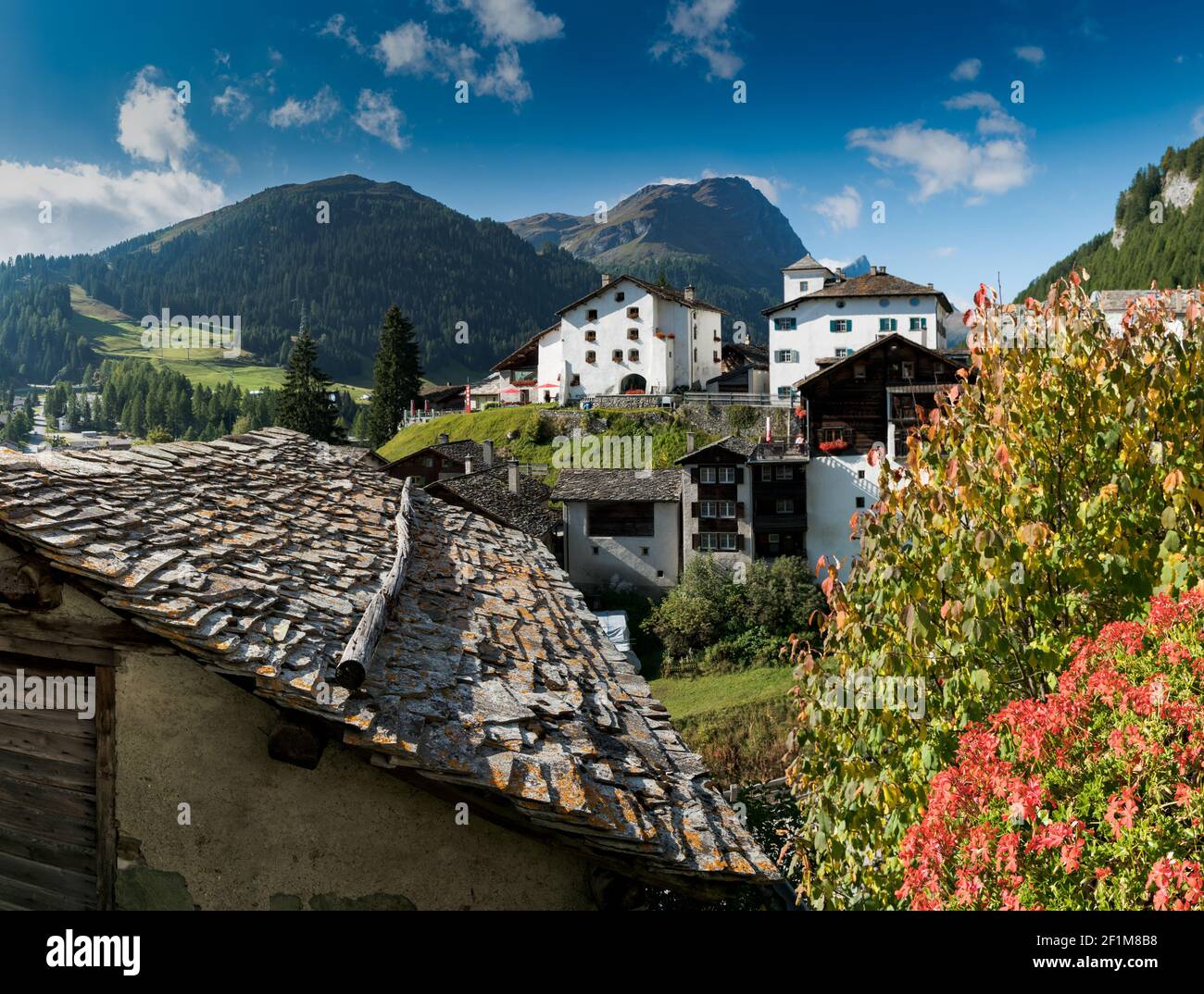 Picturesque mountain village with white stone houses and stone roofs ...