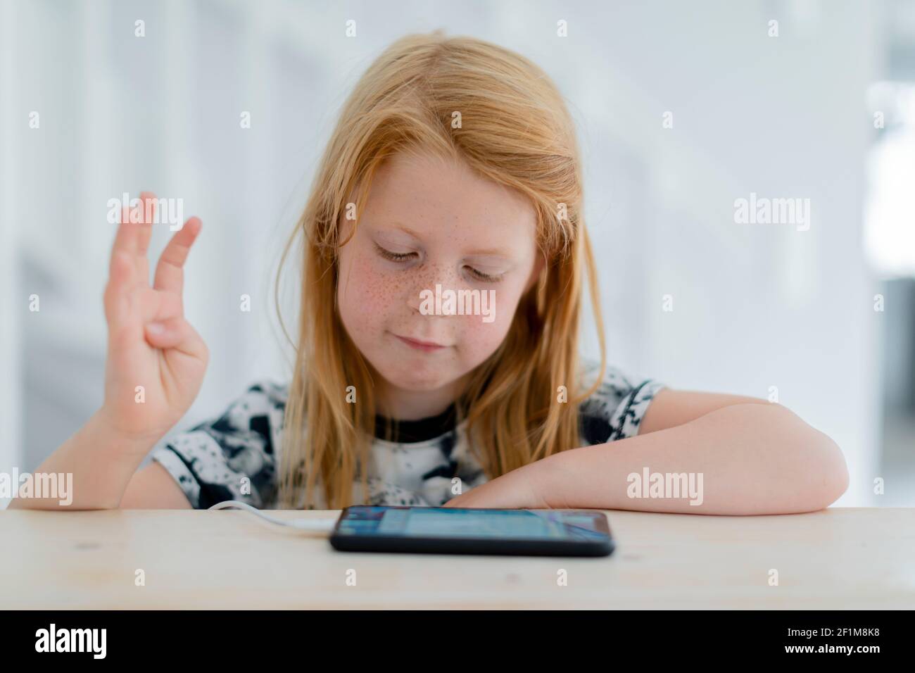 Girl using cell phone Stock Photo - Alamy