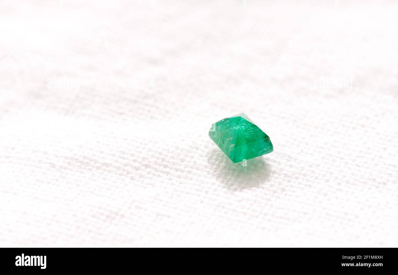 vibrant green beryl jewel cut crystal on a white background Stock Photo ...