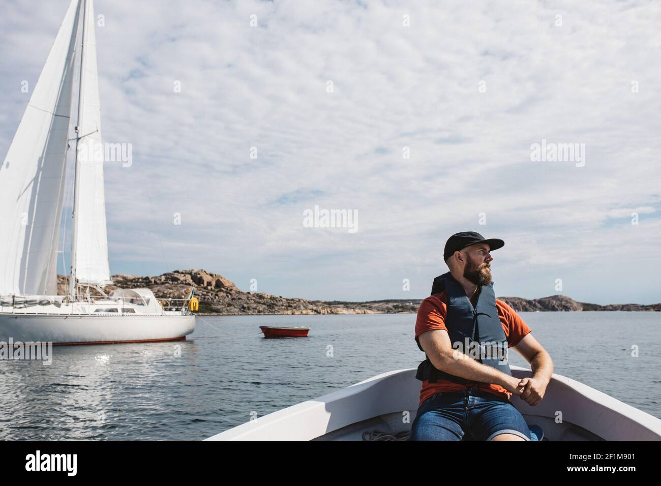 Man sitting in boat hi-res stock photography and images - Alamy