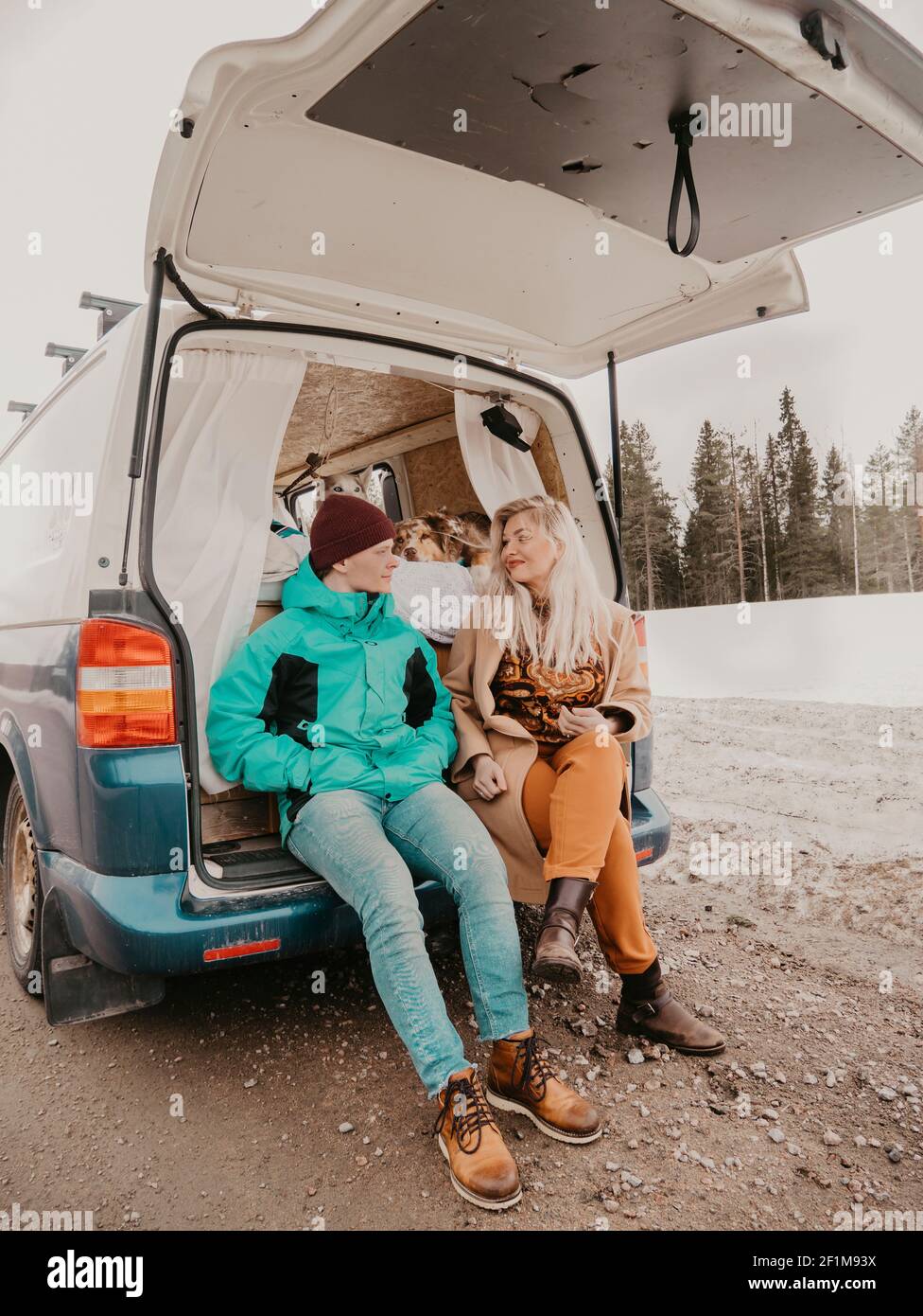 Couple sitting together in camper van Stock Photo - Alamy