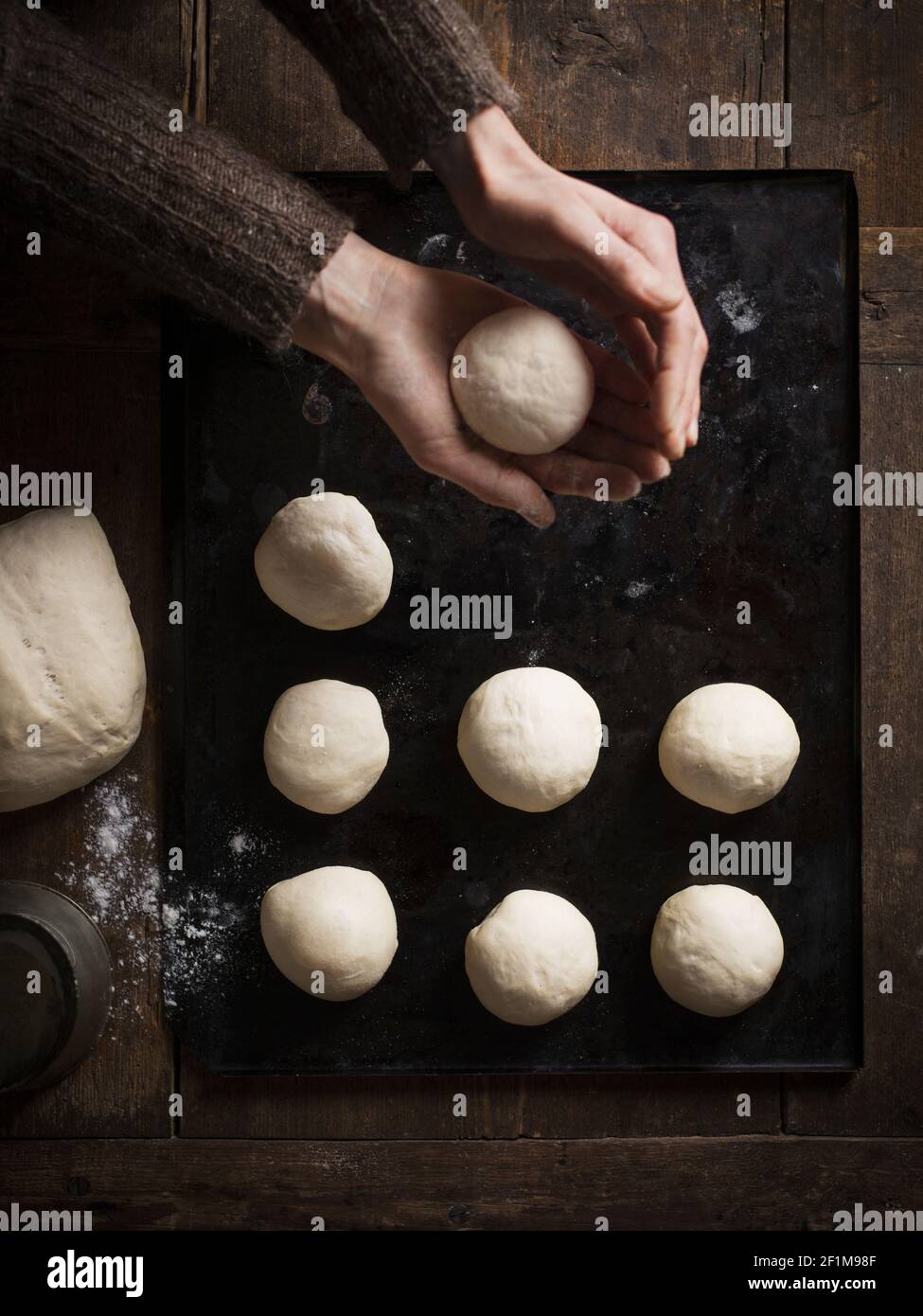 Hands forming bread rolls Stock Photo - Alamy
