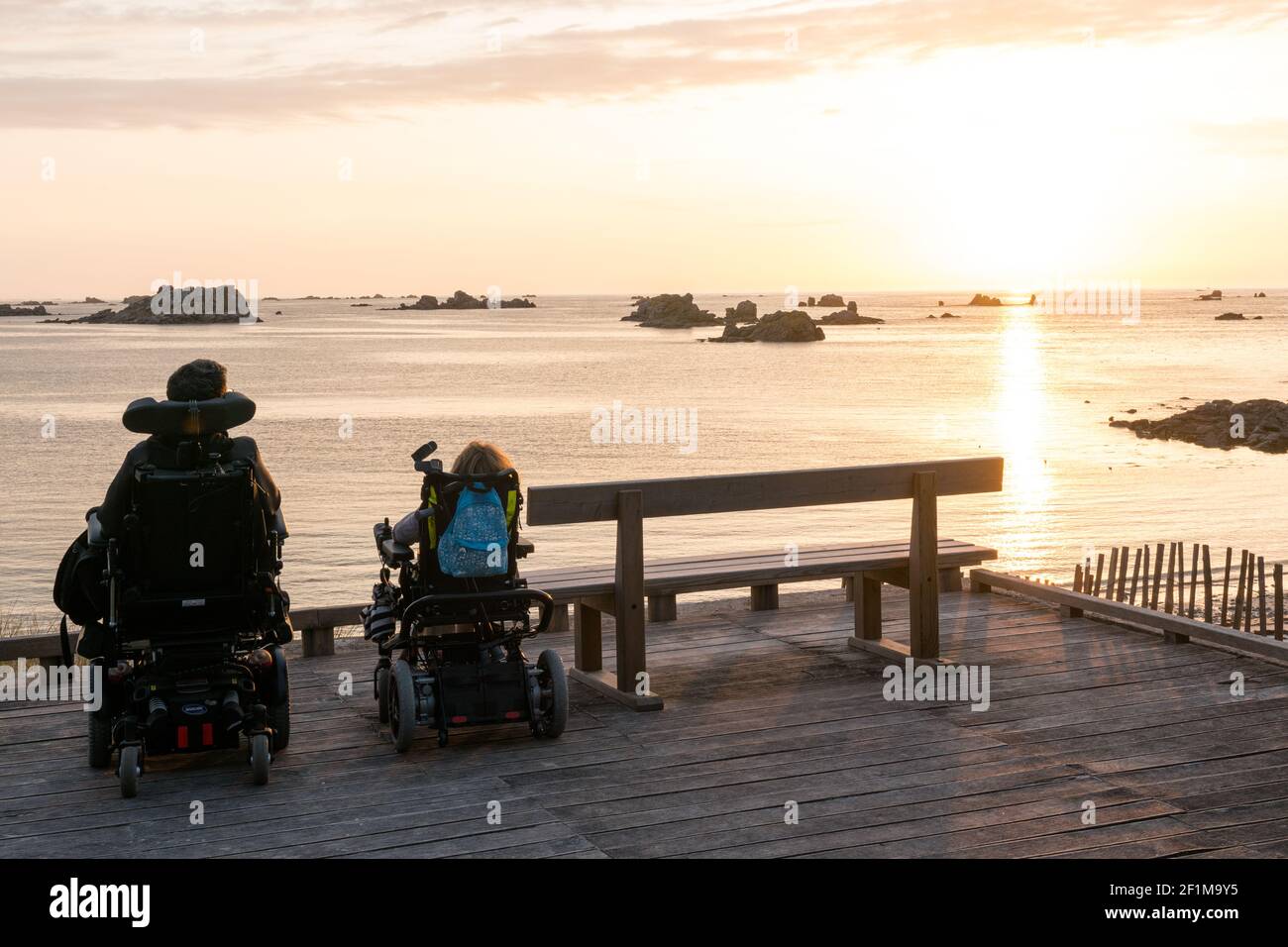 Two people in wheelchairs hi-res stock photography and images - Alamy
