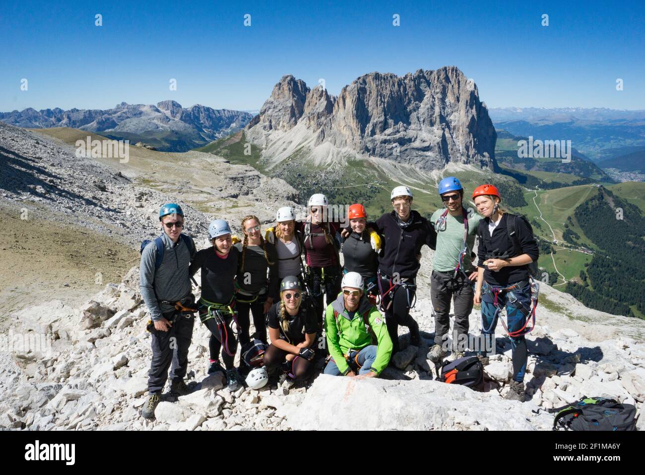 Mountain guide and group of climbers on mountain top Stock Photo - Alamy
