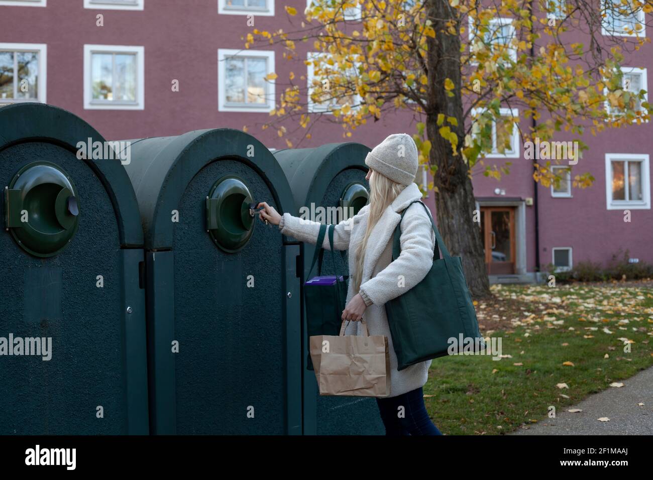 Woman bins hi-res stock photography and images - Alamy