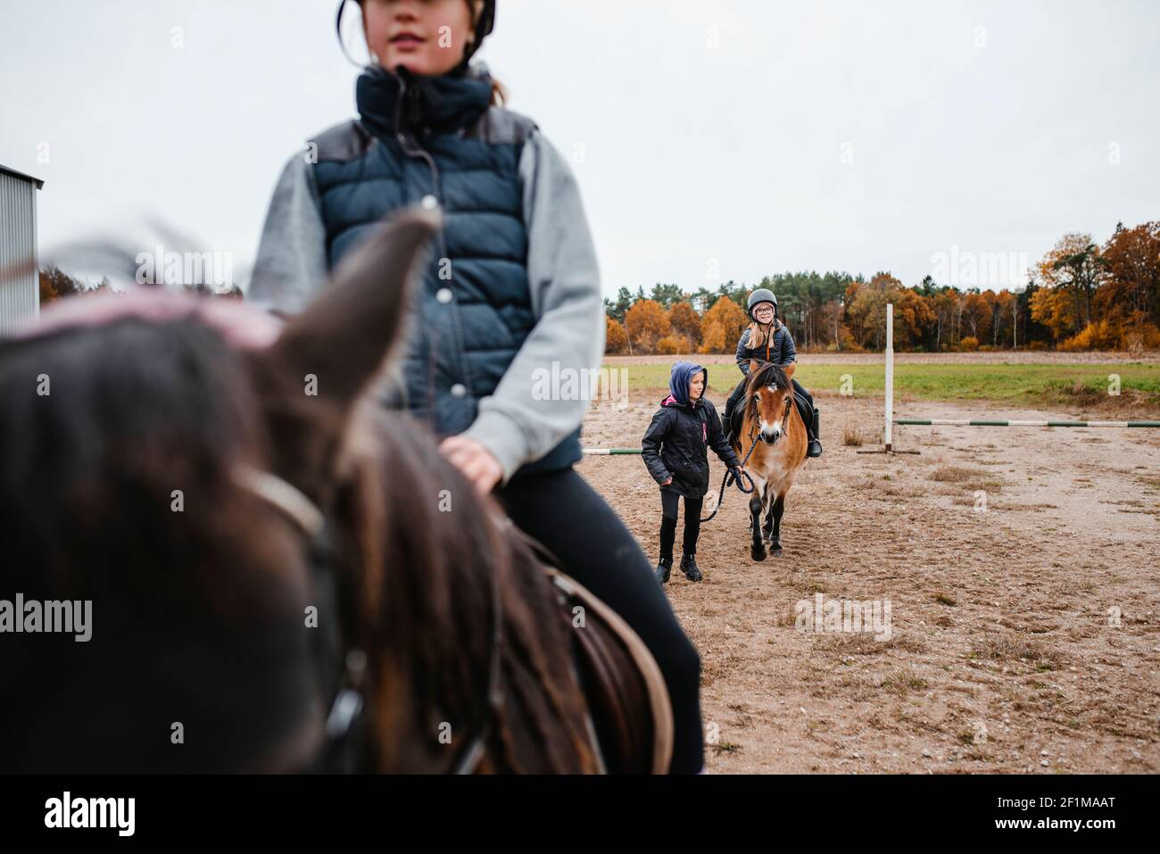 Two girls on ponies riding hi-res stock photography and images - Alamy