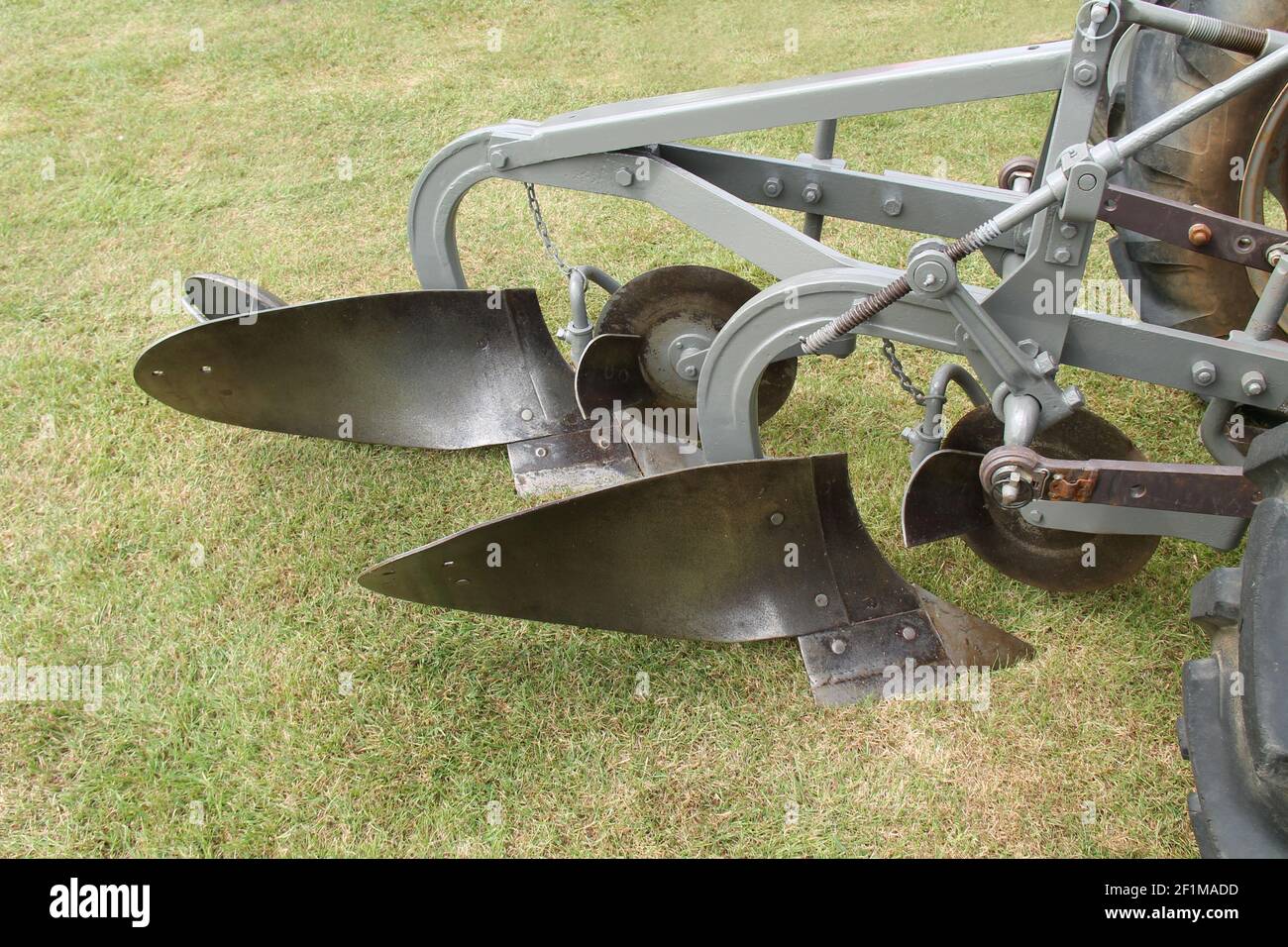 A Vintage Agricultural Farming Plough on a Tractor Stock Photo - Alamy