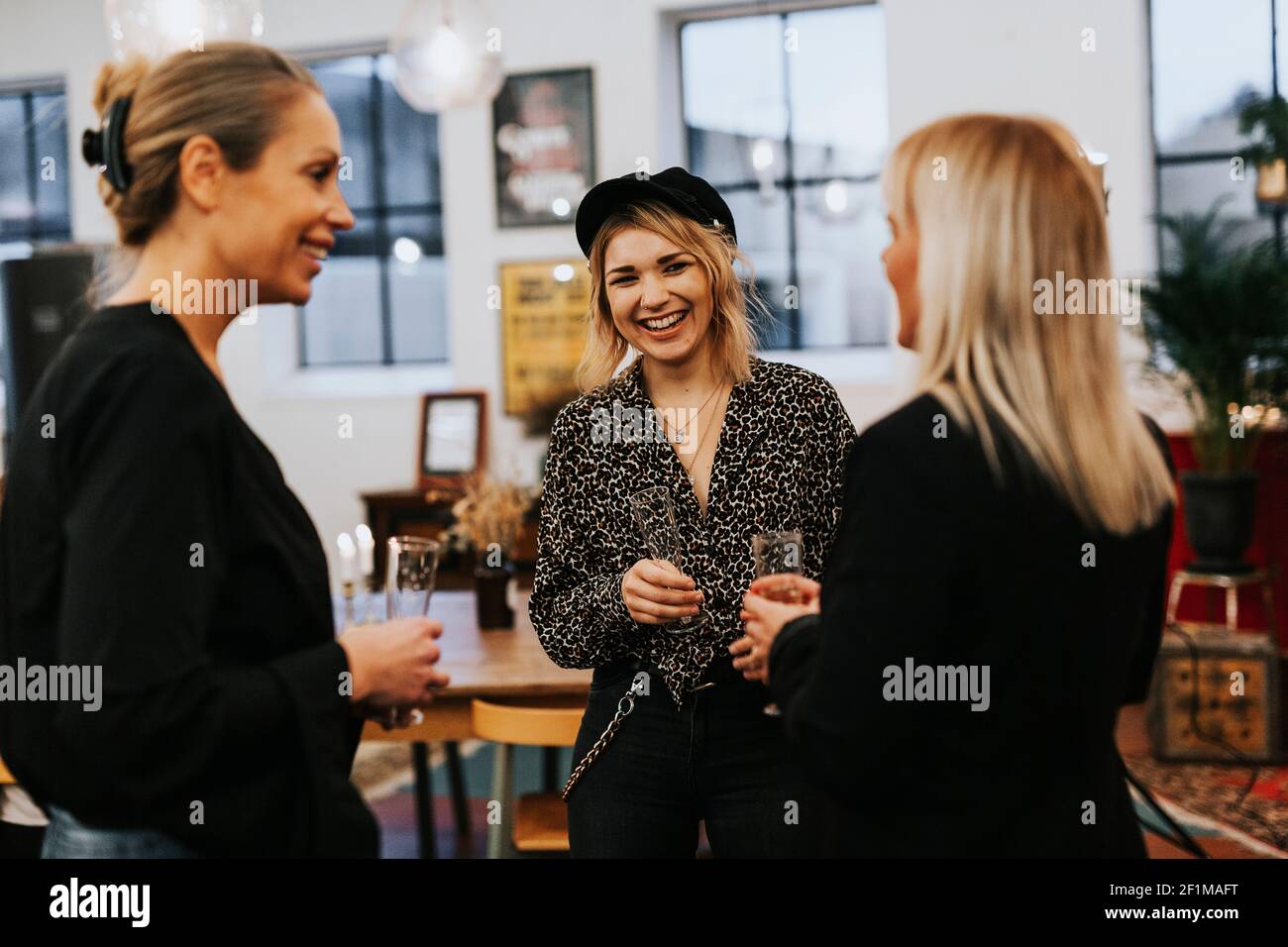 Female coworkers having meeting in cafe Stock Photo - Alamy