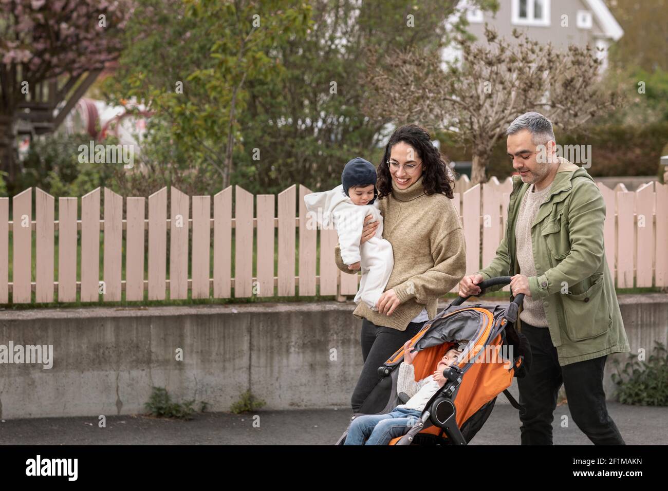 Parents with two children having walk Stock Photo - Alamy
