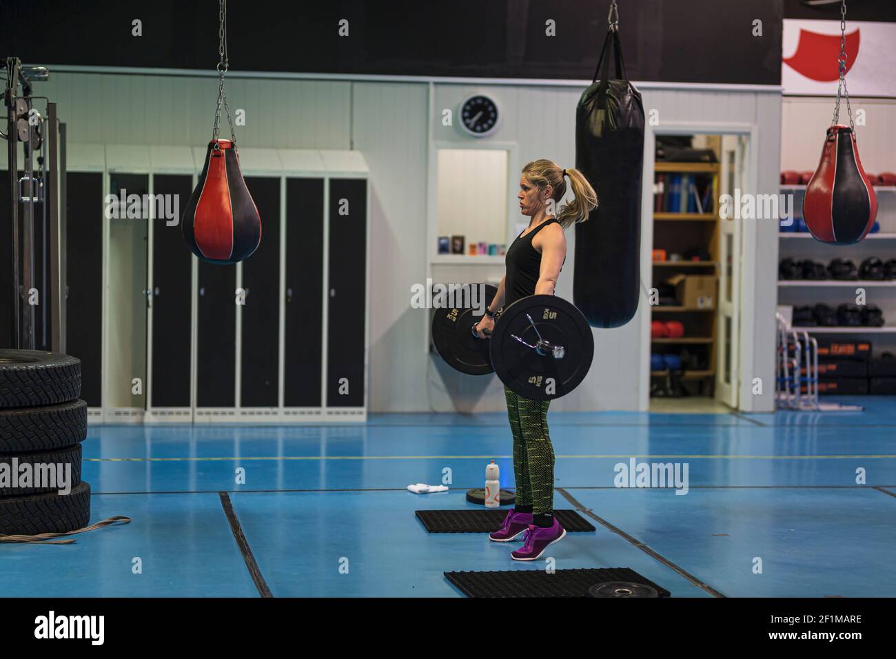 Woman weightlifting in gym Stock Photo - Alamy