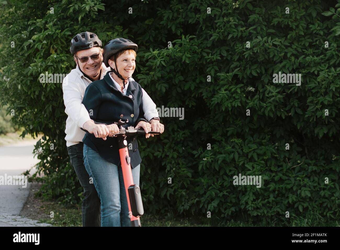Electric scooter two people hi-res stock photography and images - Alamy