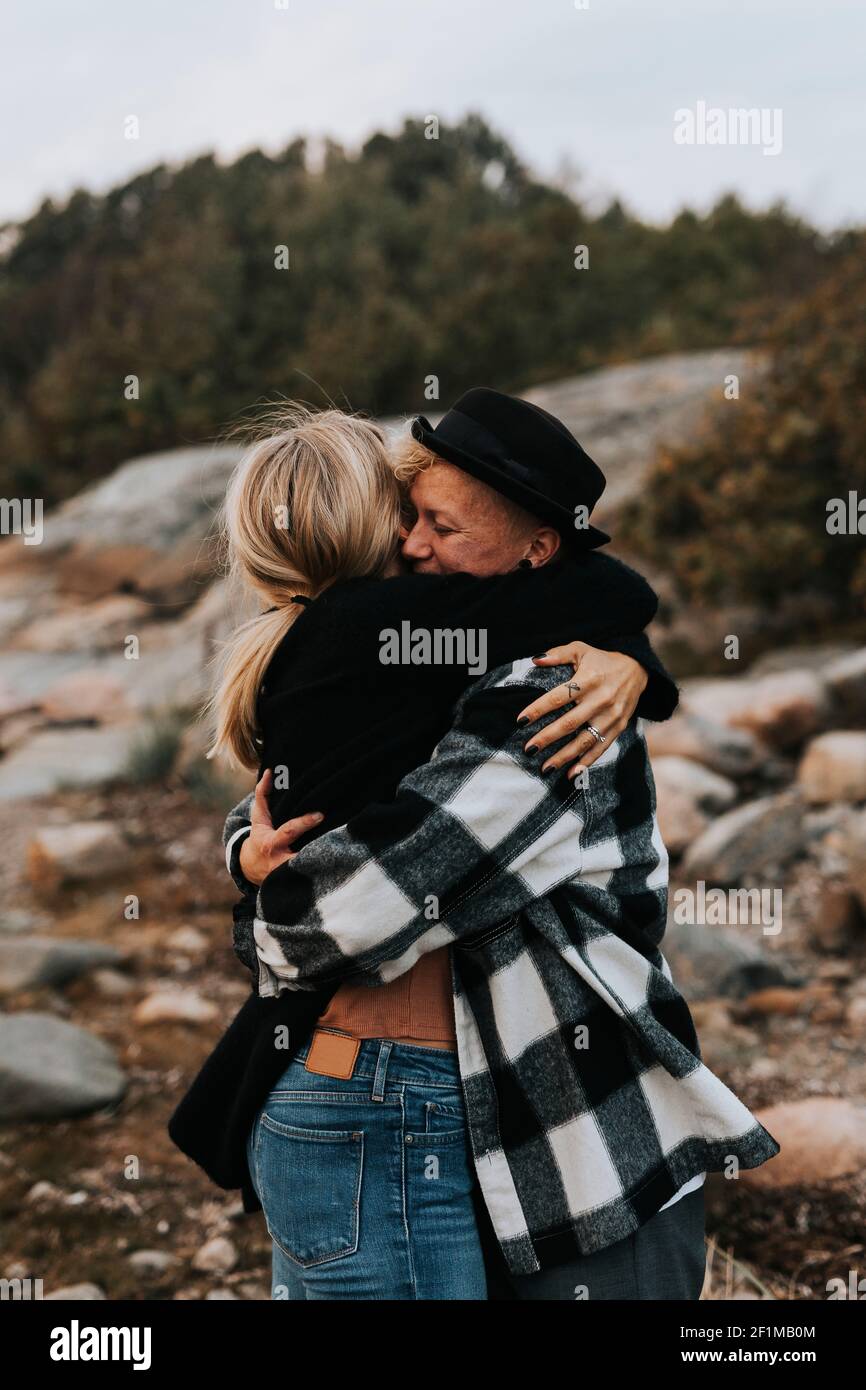 Female couple hugging Stock Photo - Alamy