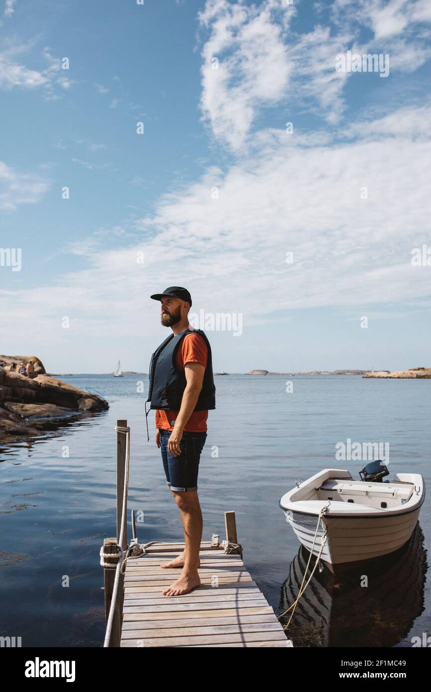 Man motorboat jetty hi-res stock photography and images - Alamy